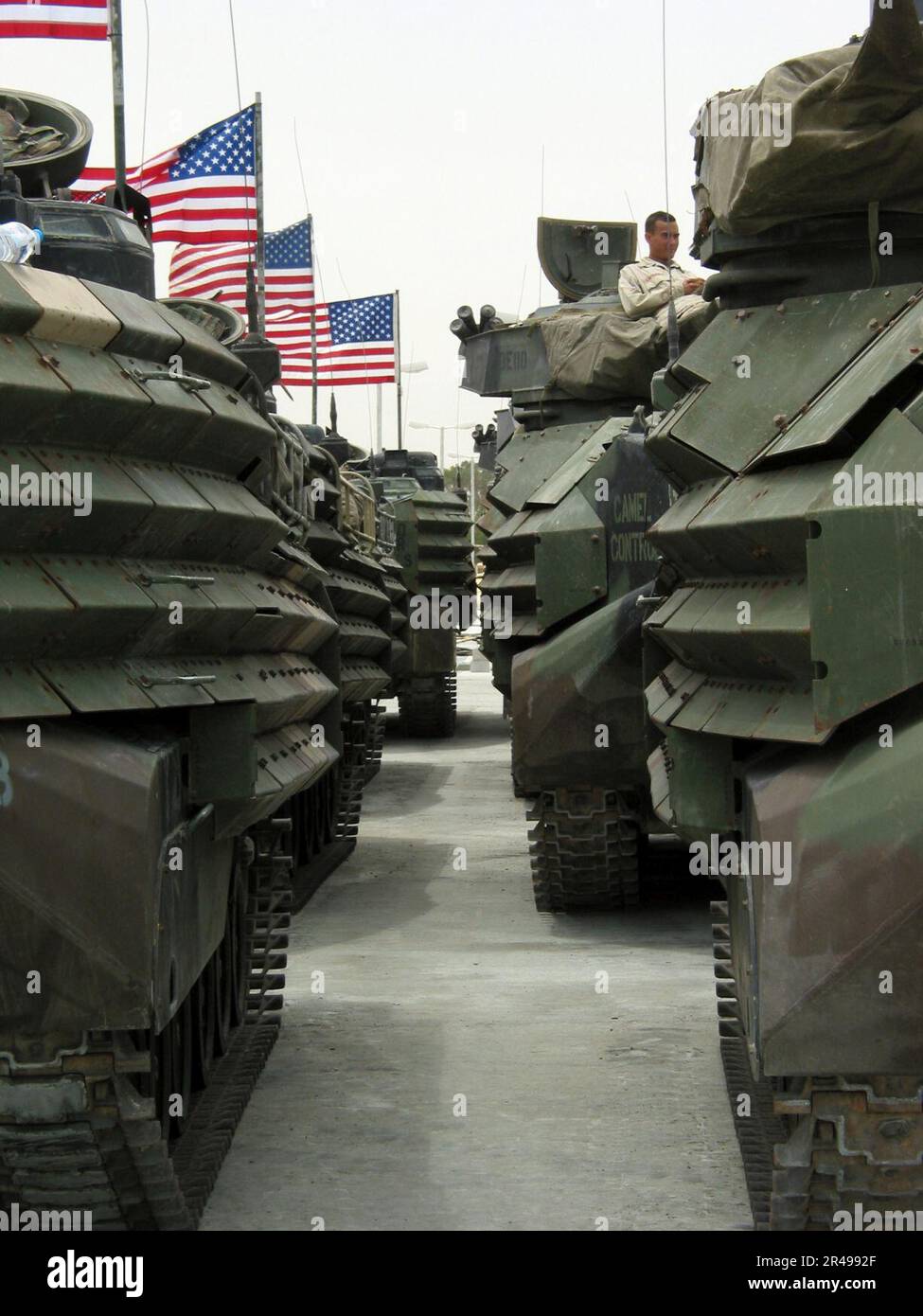 US Navy A lone Marine sits amongst a sea of flags and Amphibious ...