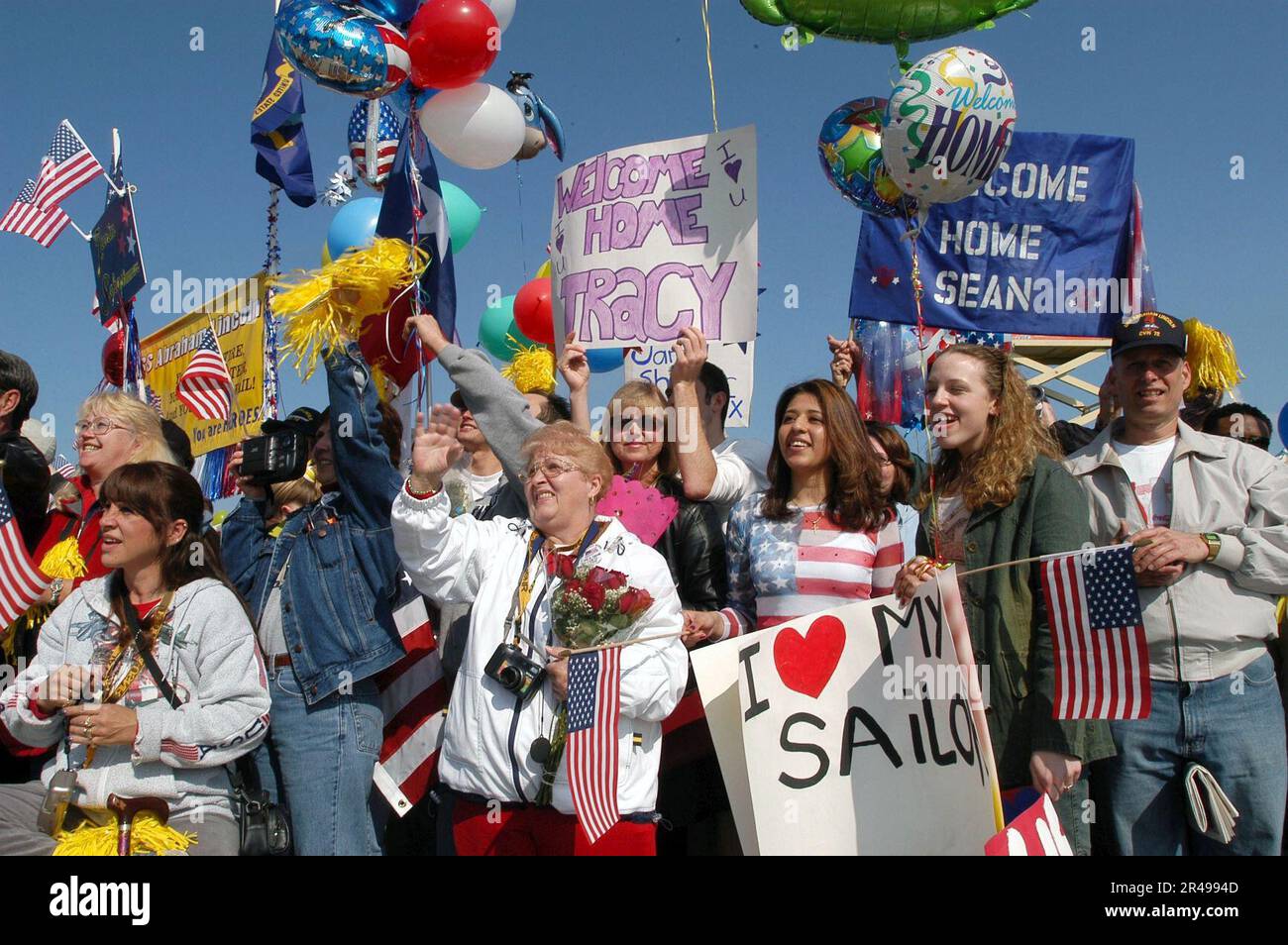 US Navy Family and friends gather on the pier to show their support as ...