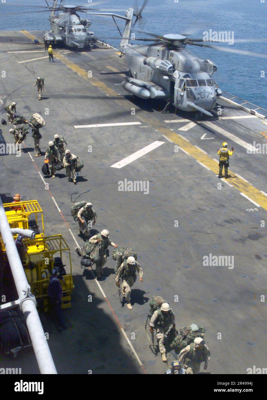 US Navy Marines return to the multi-purpose amphibious assault ship USS ...