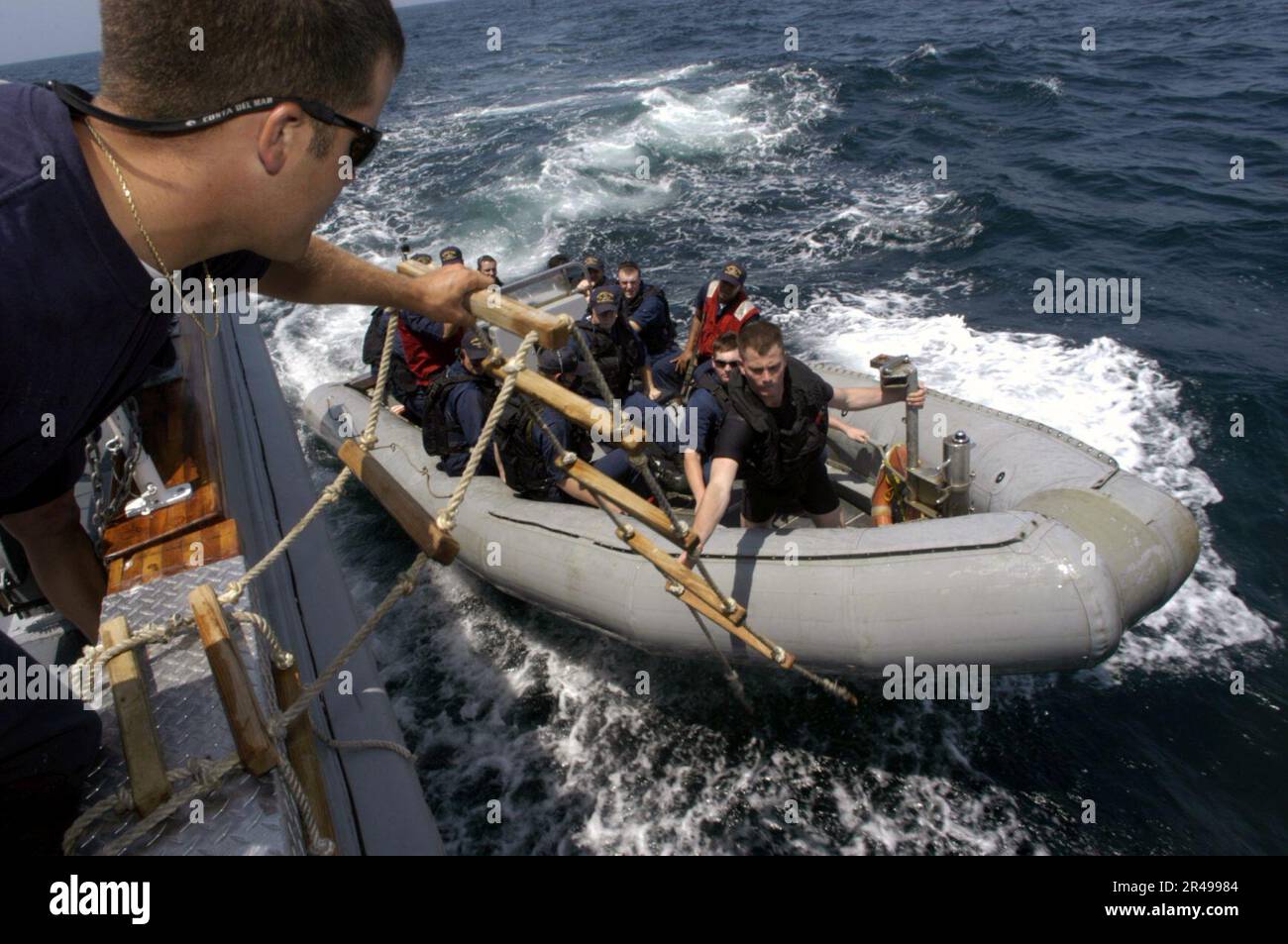 US Navy A crewmember aboard Yard Boarding Craft Seven Zero Two (YP 702 ...