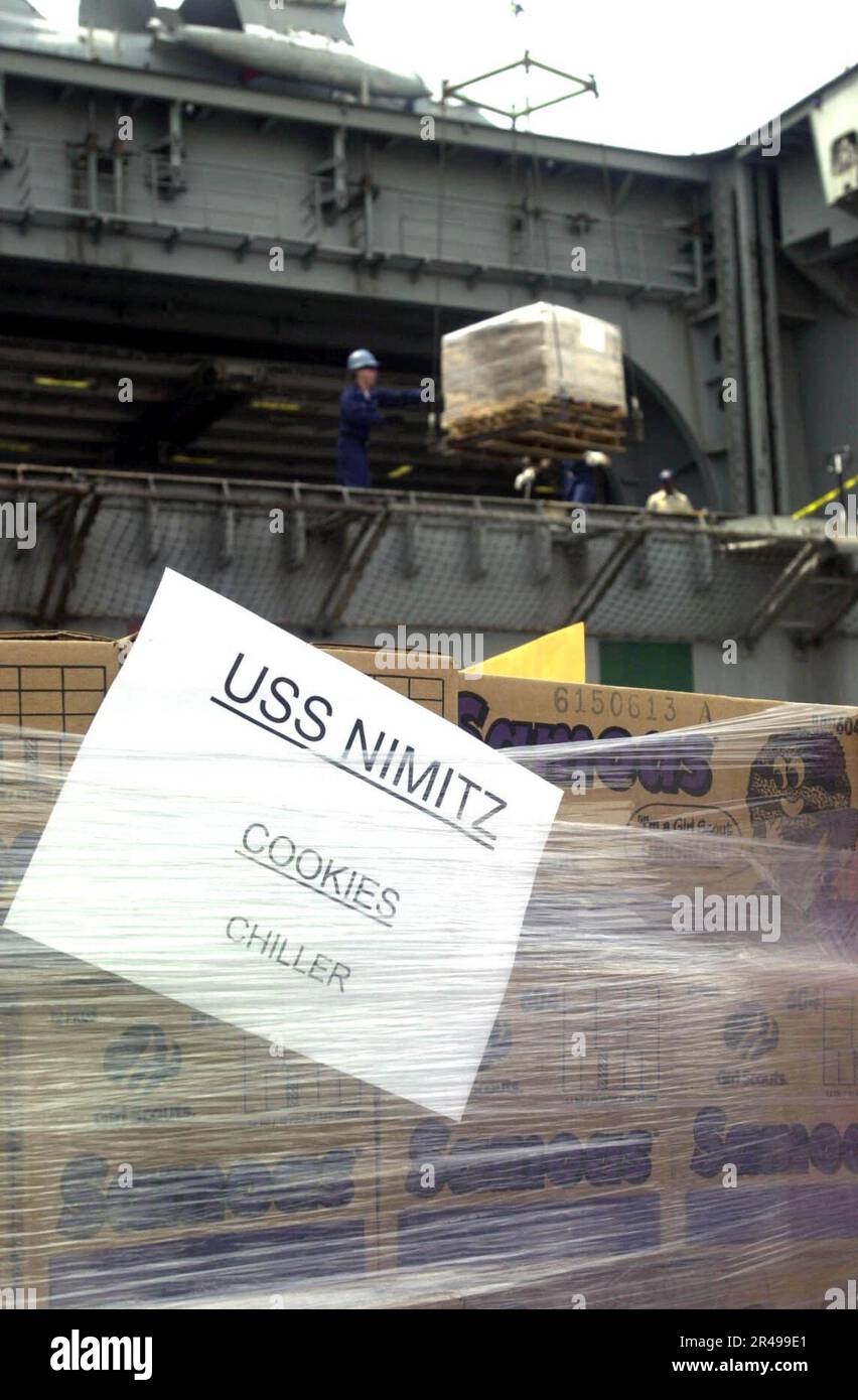 US Navy Pallets of Girl Scout Cookies are ready to be taken aboard USS ...