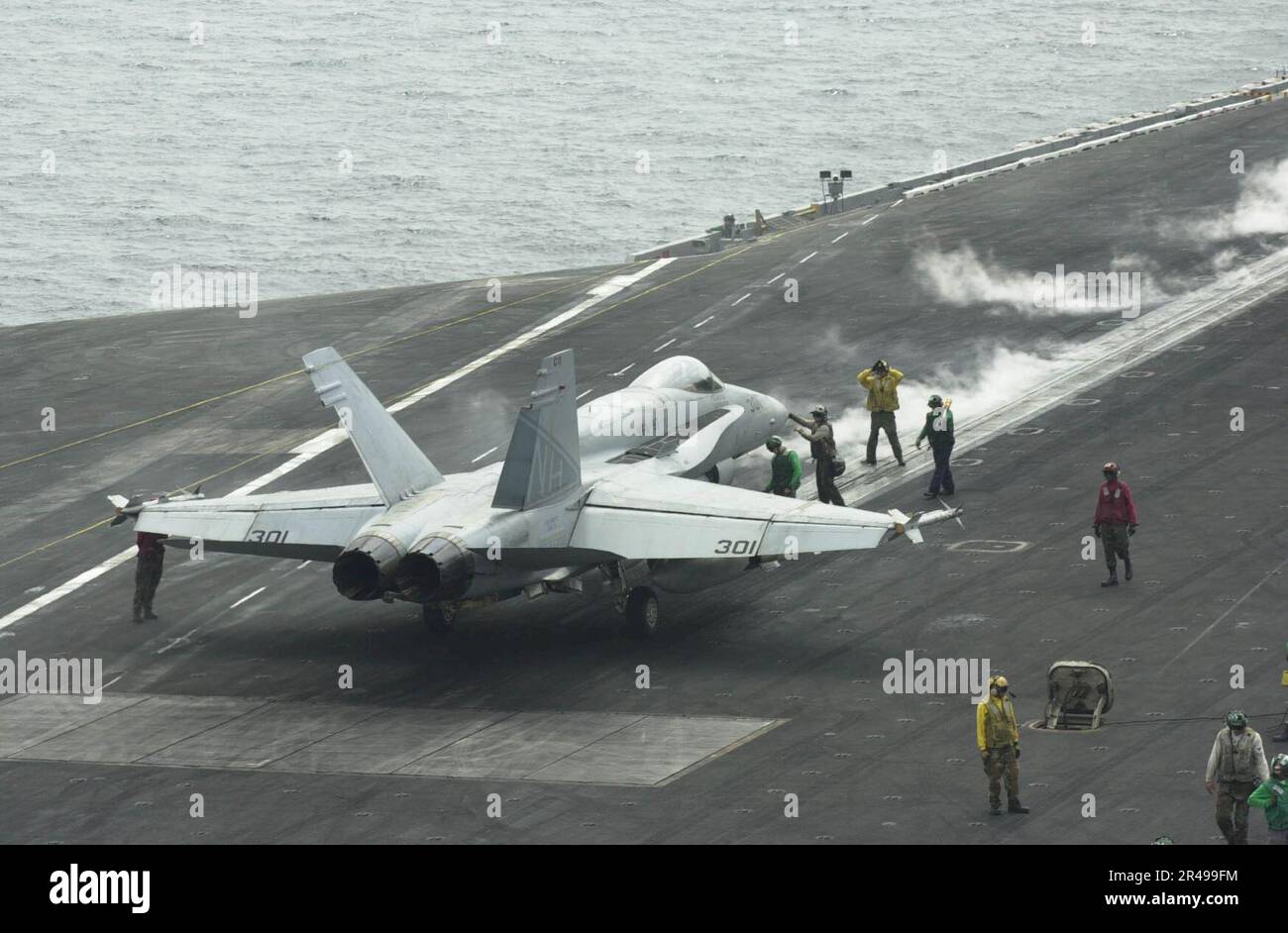 US Navy An F-A-18 Hornet prepares to launch from one of four steam ...