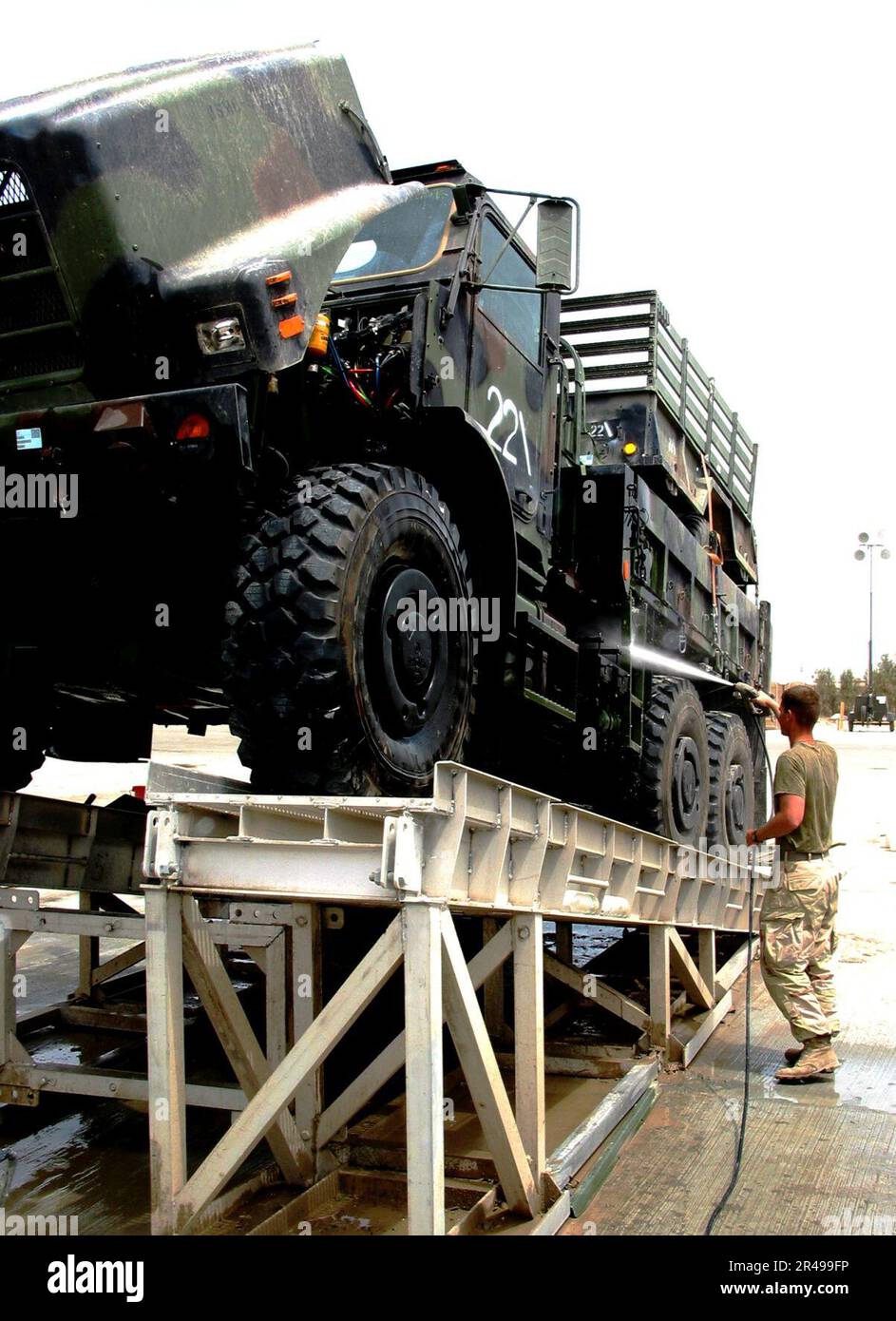 US Navy U.S. Marines assigned to Task Force Tarawa wash down their ...