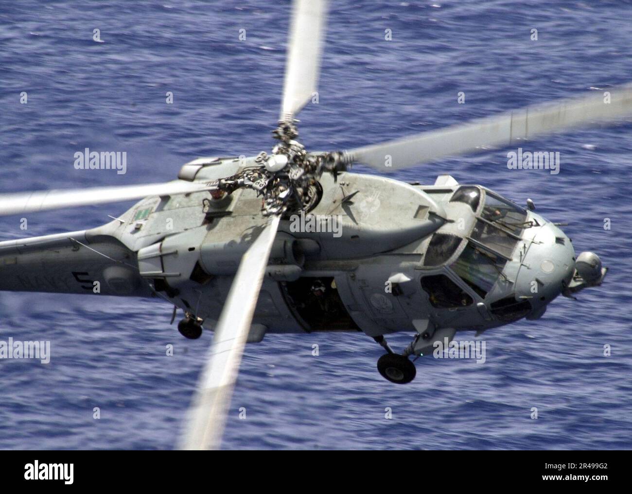 US Navy Seahawk banks sharply towards the Constellation to demonstrate ...