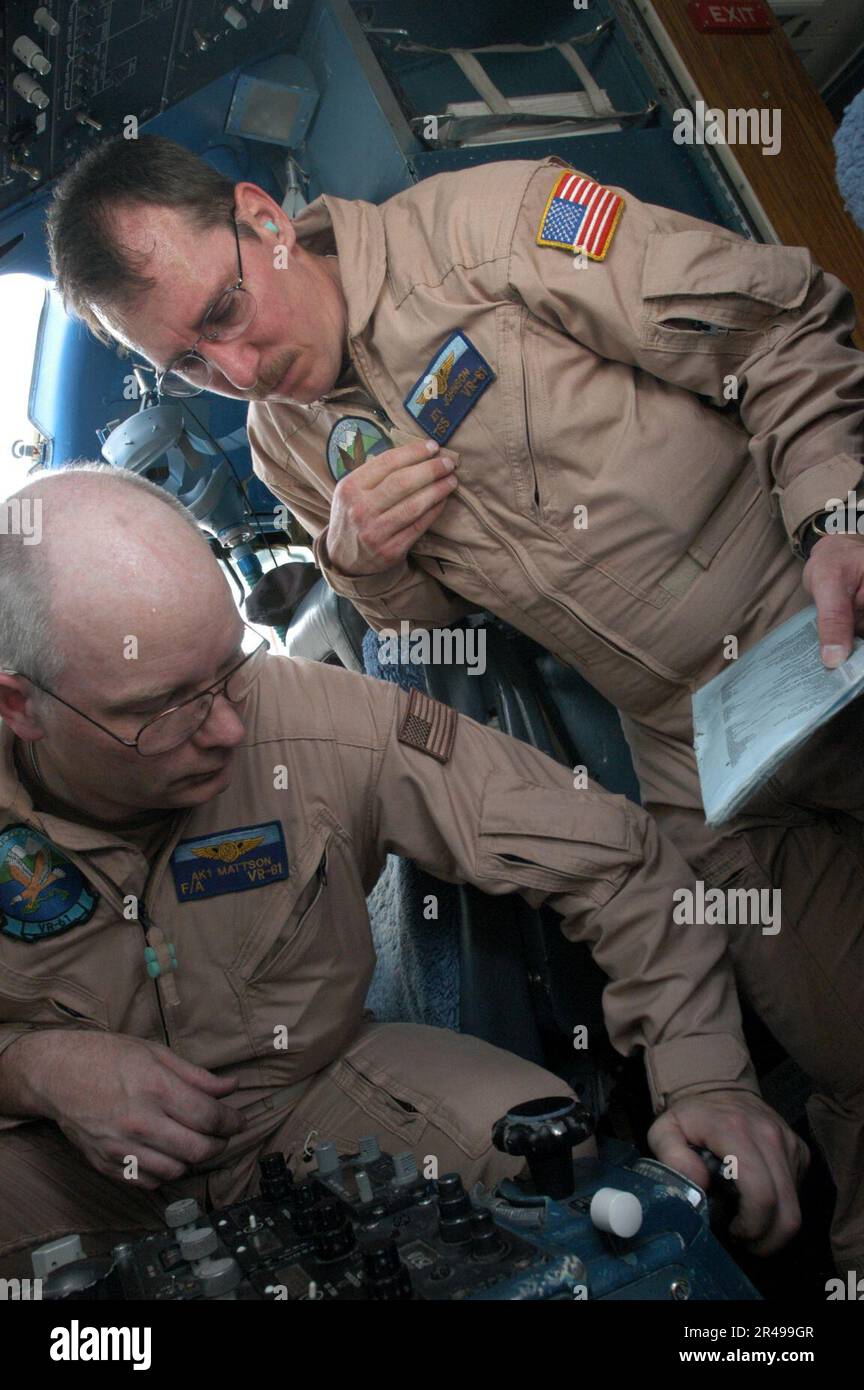 US Navy Aviation Storekeeper 1st Class performs pre-flight checks under ...