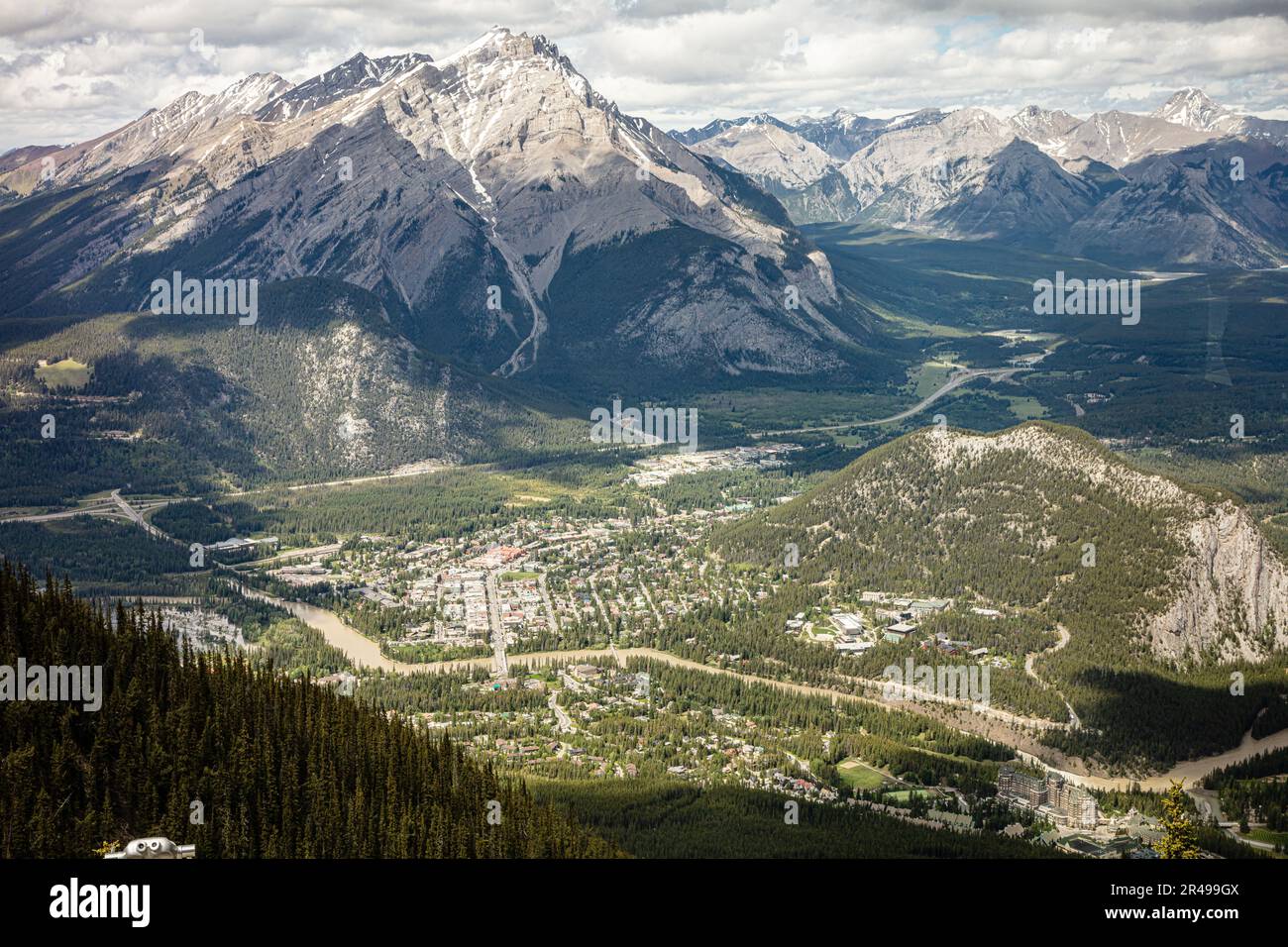 A scenic view of a valley surrounded by rocky mountains. Banff National ...