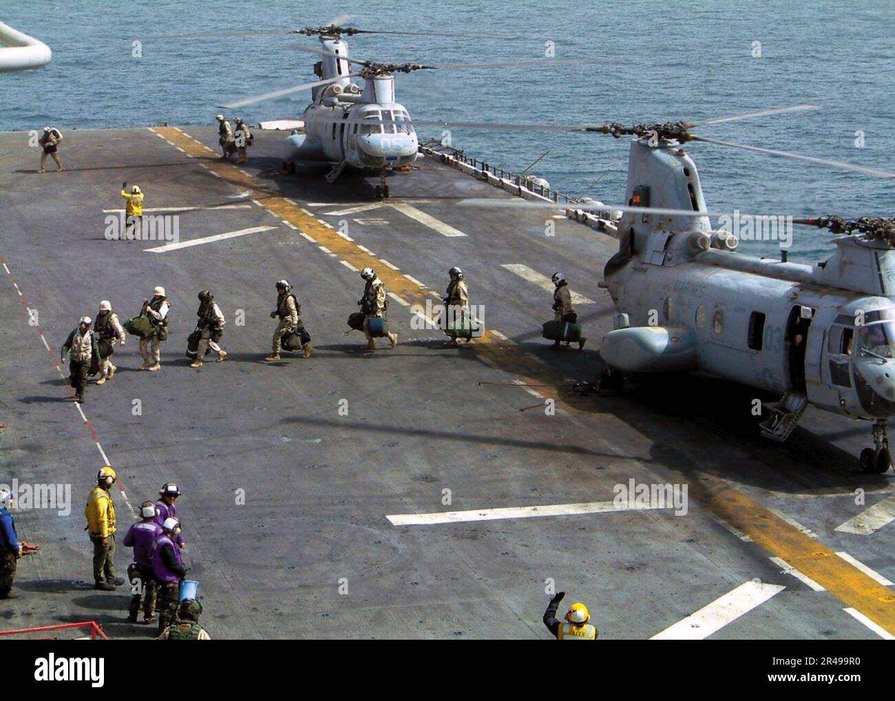 US Navy Marines return to the amphibious assault ship USS Boxer (LHD 4 ...