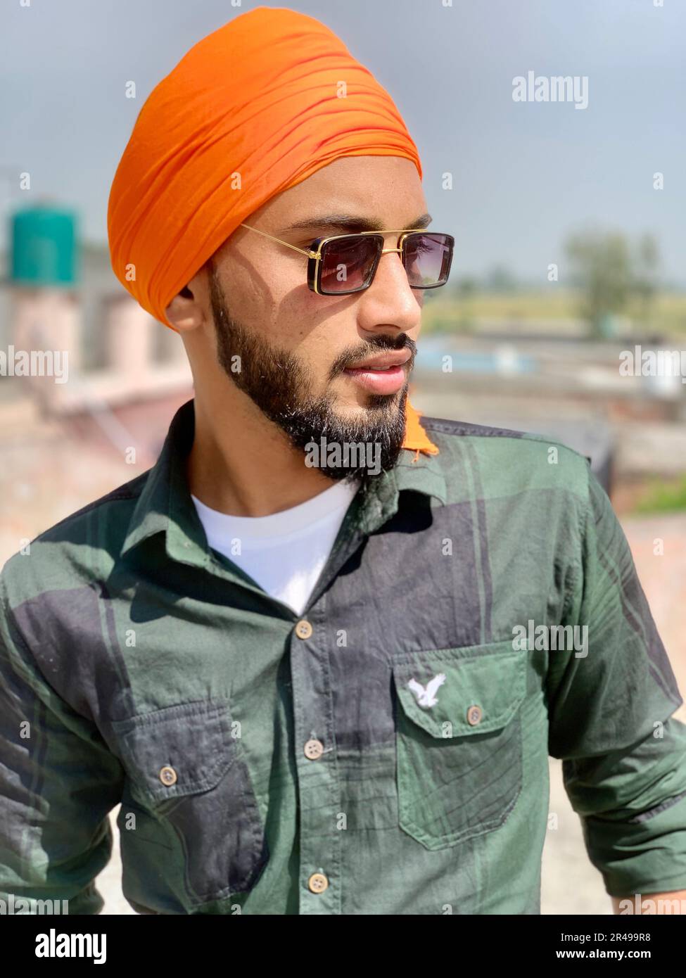 A vertical portrait of an Arab man posing outdoors Stock Photo - Alamy