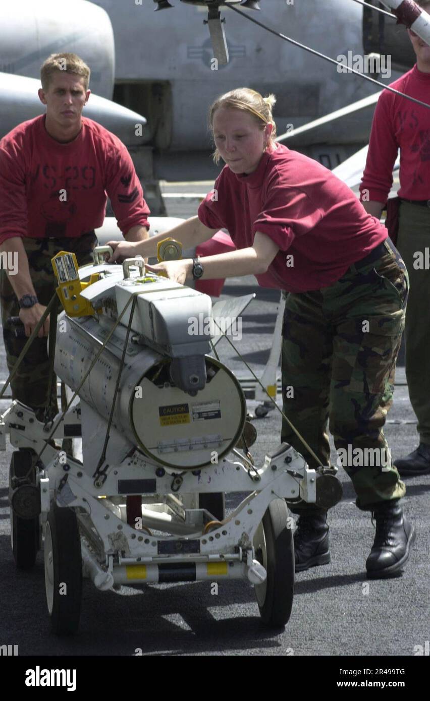 US Navy Aviation Ordnancemen load a Stand Off Land Attack Missile ...