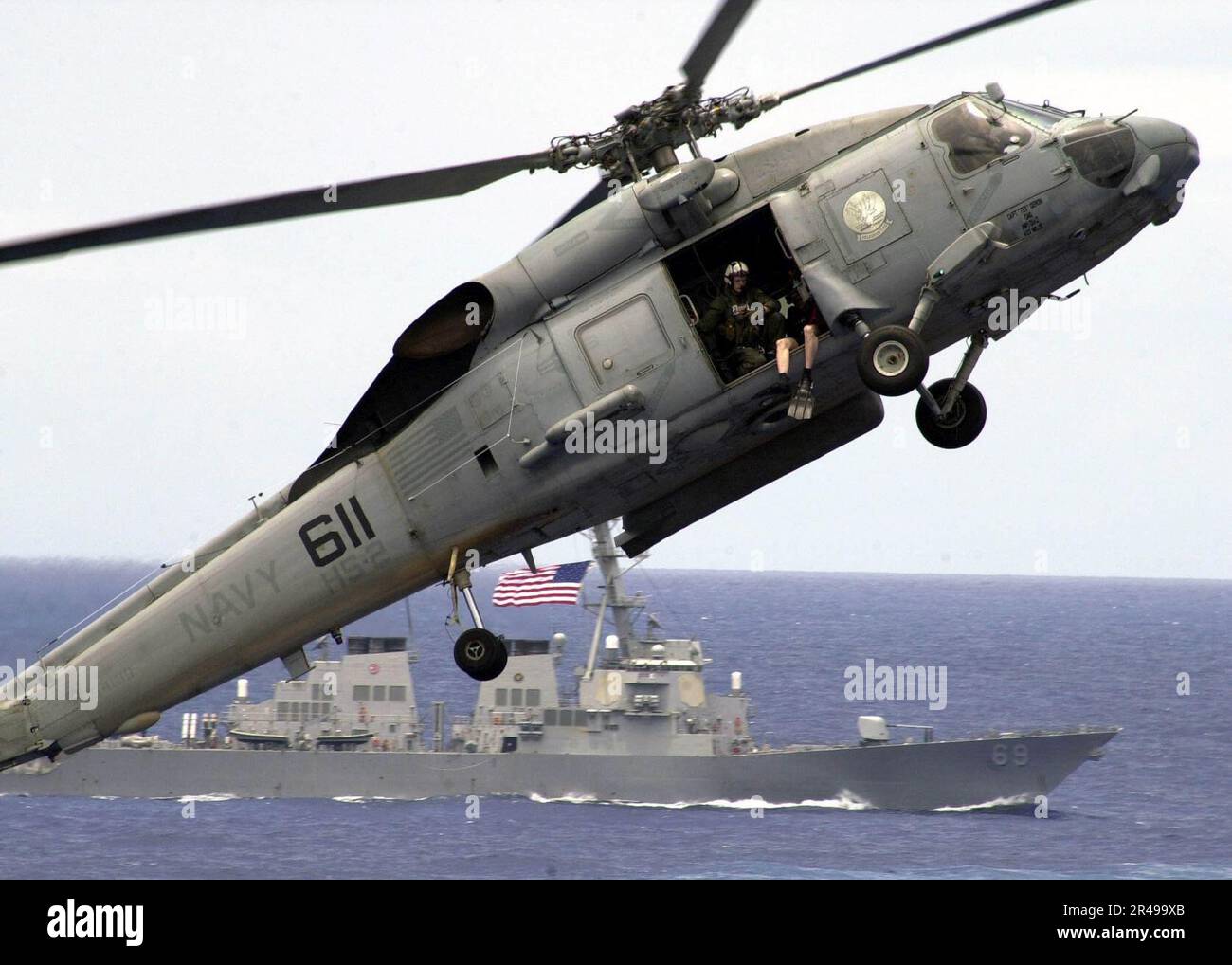 US Navy An SH-60 Seahawk helicopter slows down to lower it's rescue ...