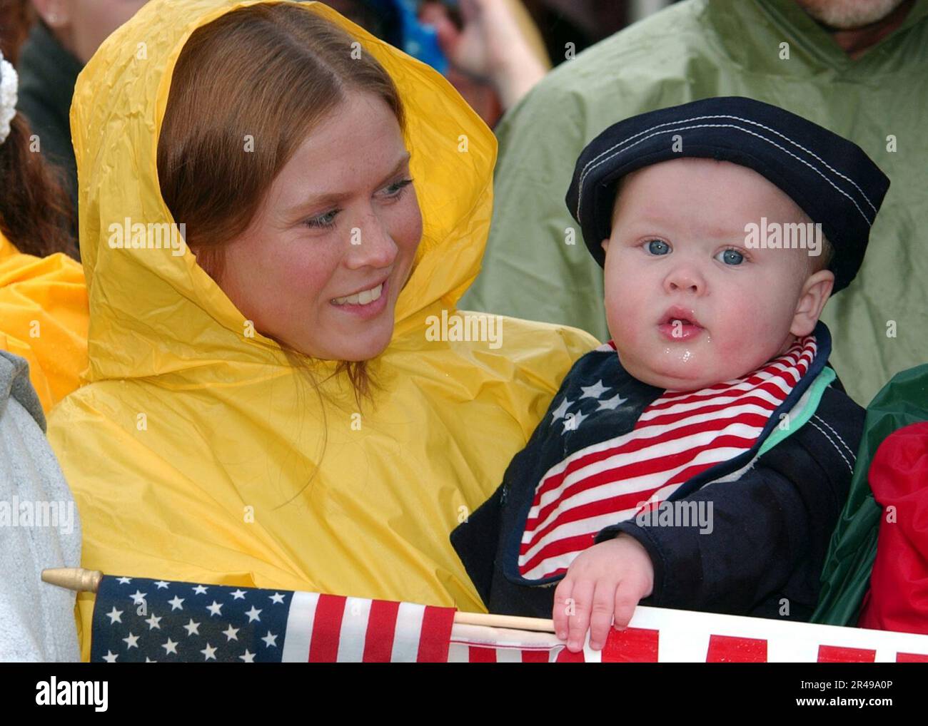 US Navy A Navy wife and mother holds her nine-month-old child, while ...