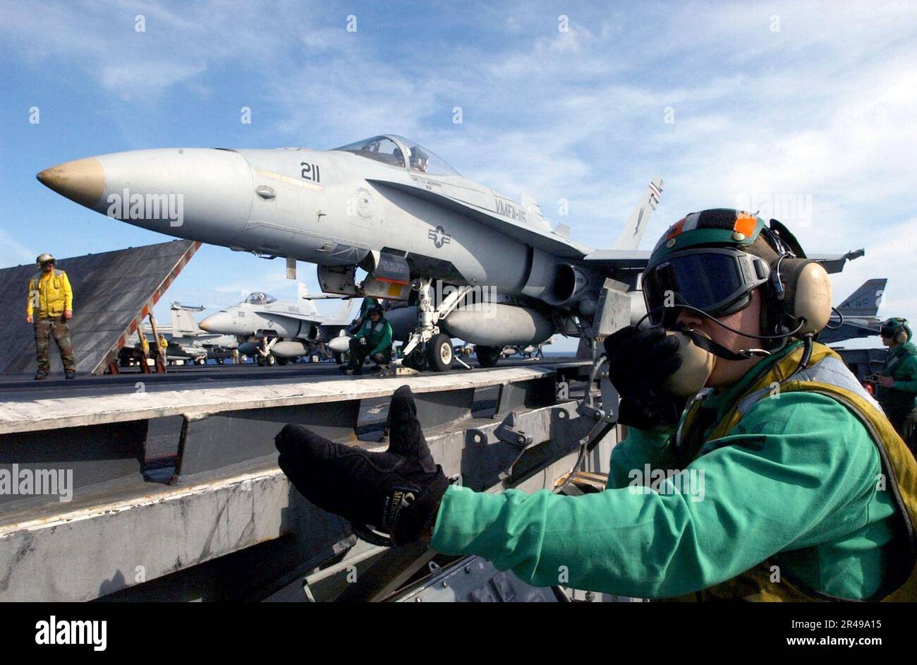 US Navy An Aviation Boatswain's Mate stands the Deck Edge Safety watch ...