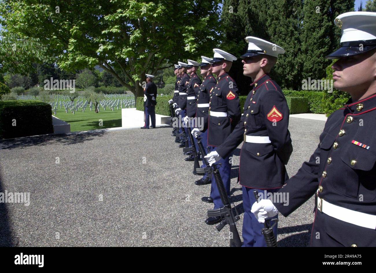 US Navy The U.S. Marine firing detail stands at parade rest during a ...