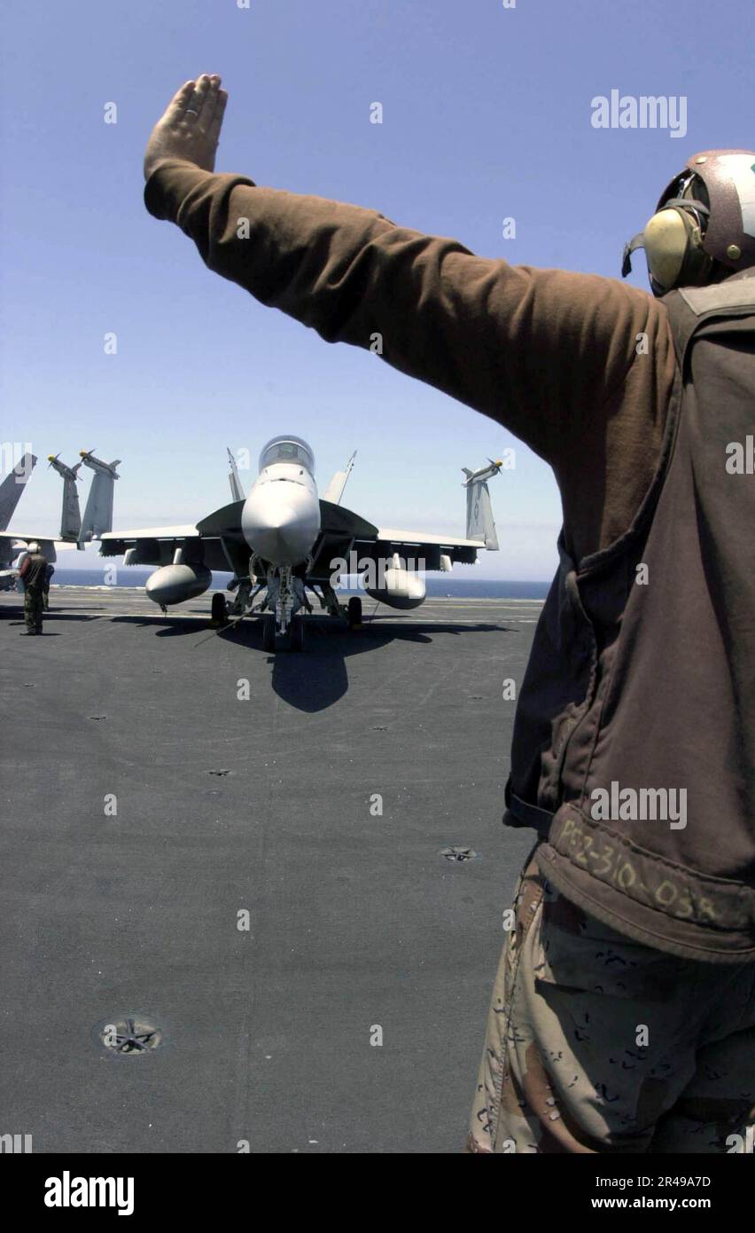 US Navy A plane captain begins start-up procedures on an F-A-18 Super ...