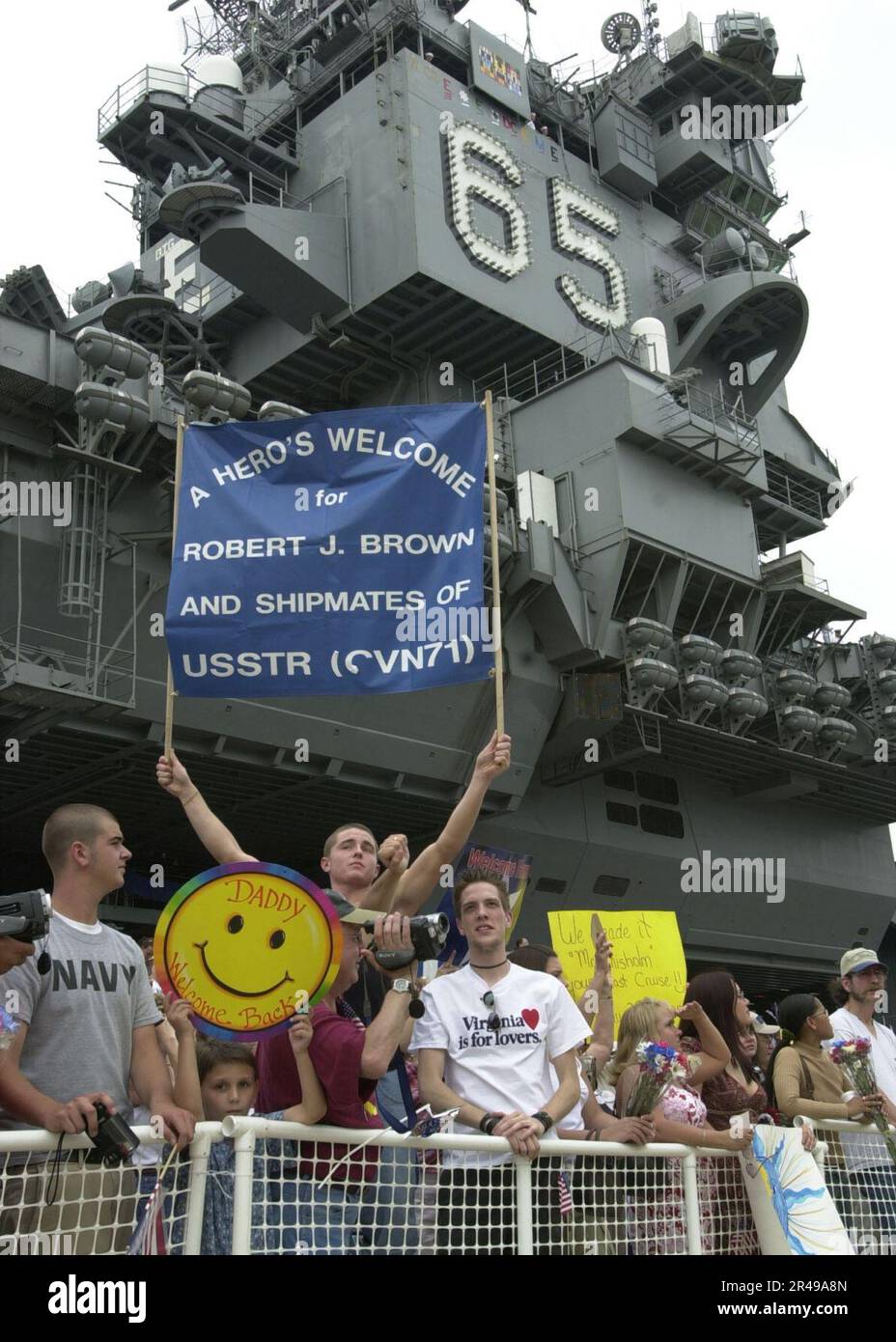 US Navy Friends and family of crewmembers aboard the aircraft carrier ...