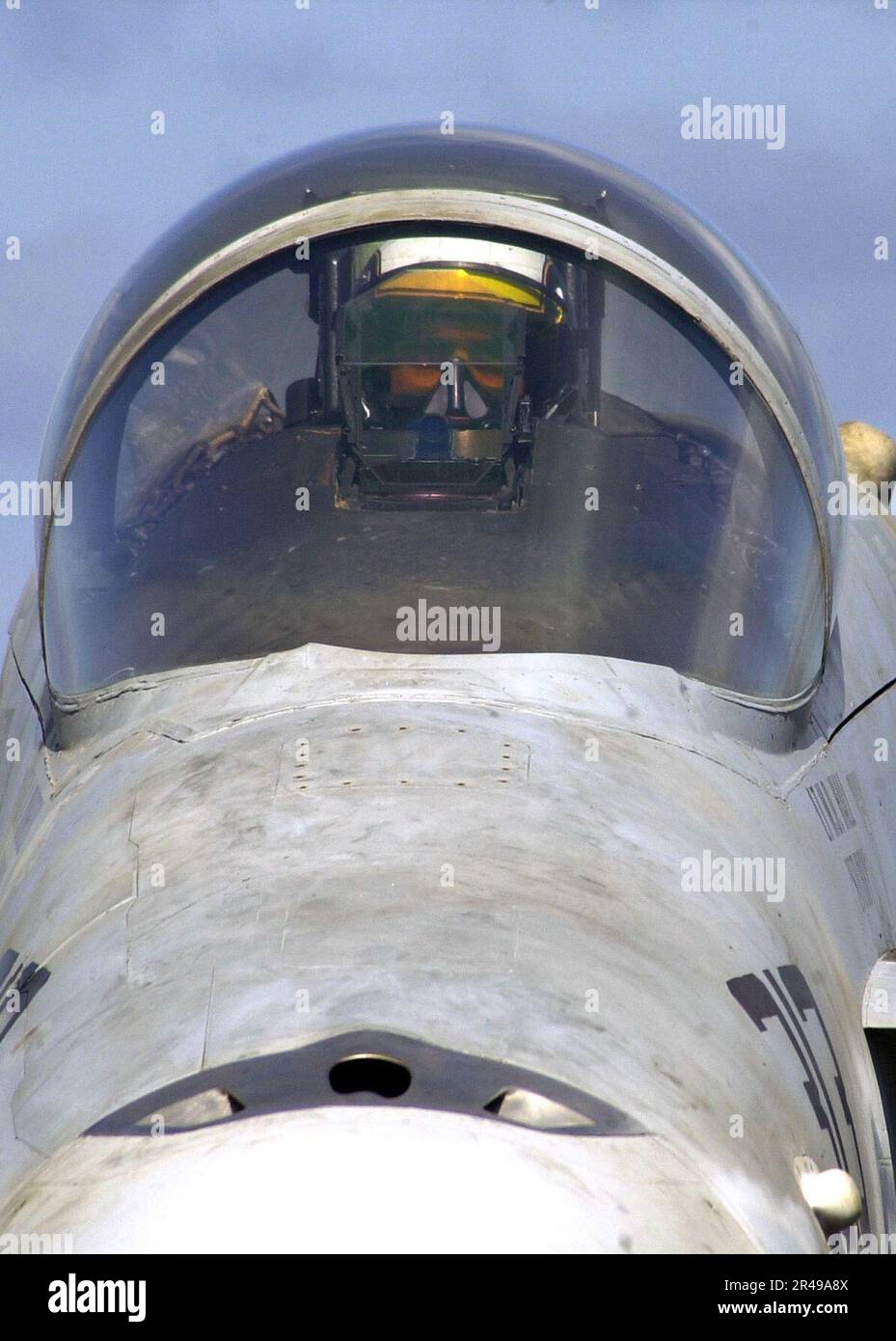 US Navy A pilot looks through his Heads-Up Display (HUD) while sitting ...