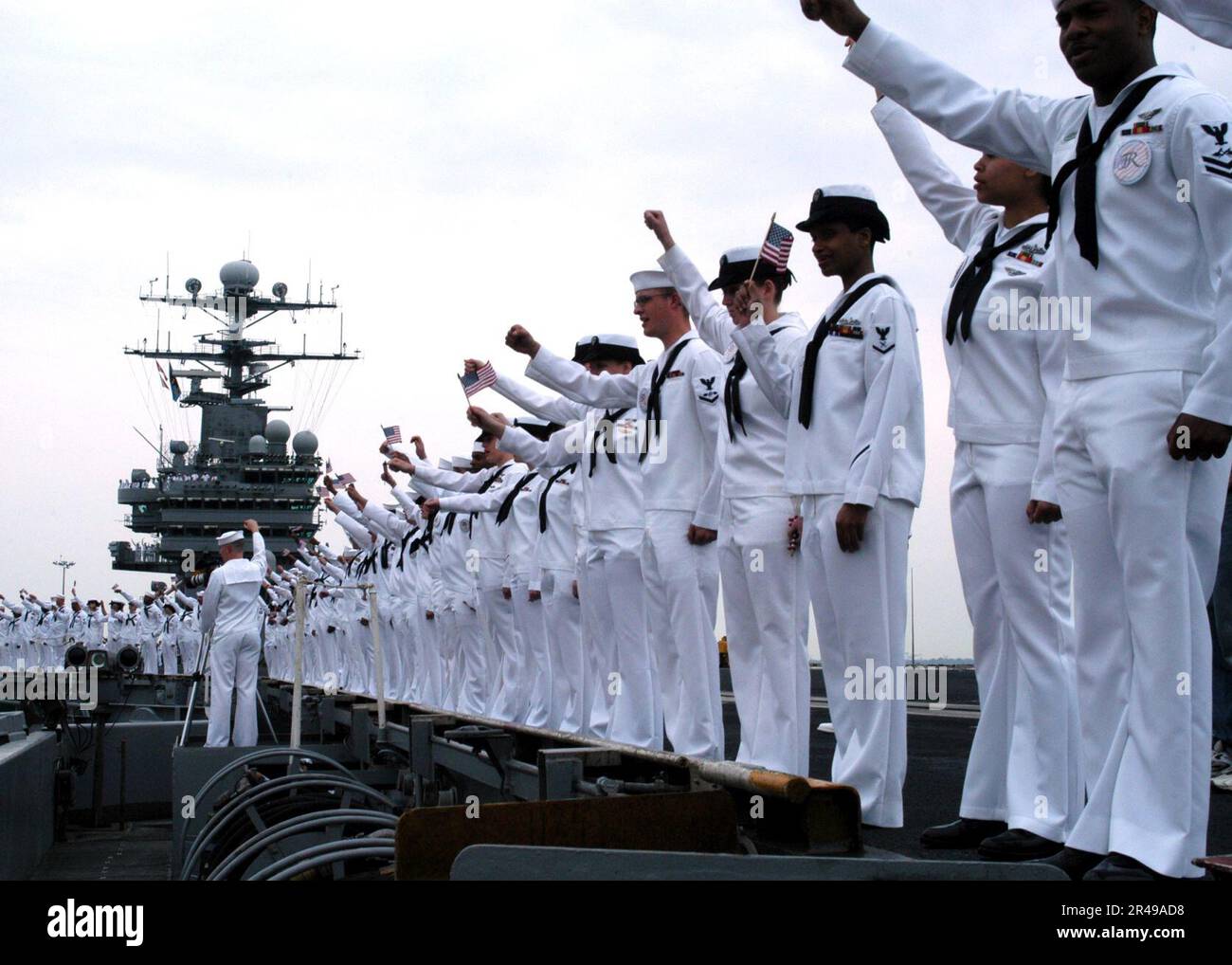 US Navy Sailors man the rails as USS Theodore Roosevelt (CVN 71) is ...