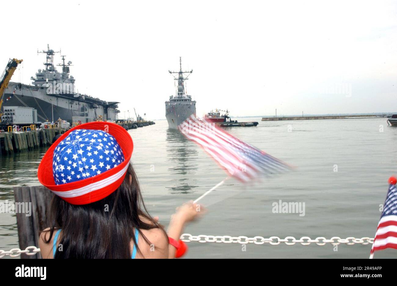 US Navy Friends and family members of Sailors aboard the guided missile ...