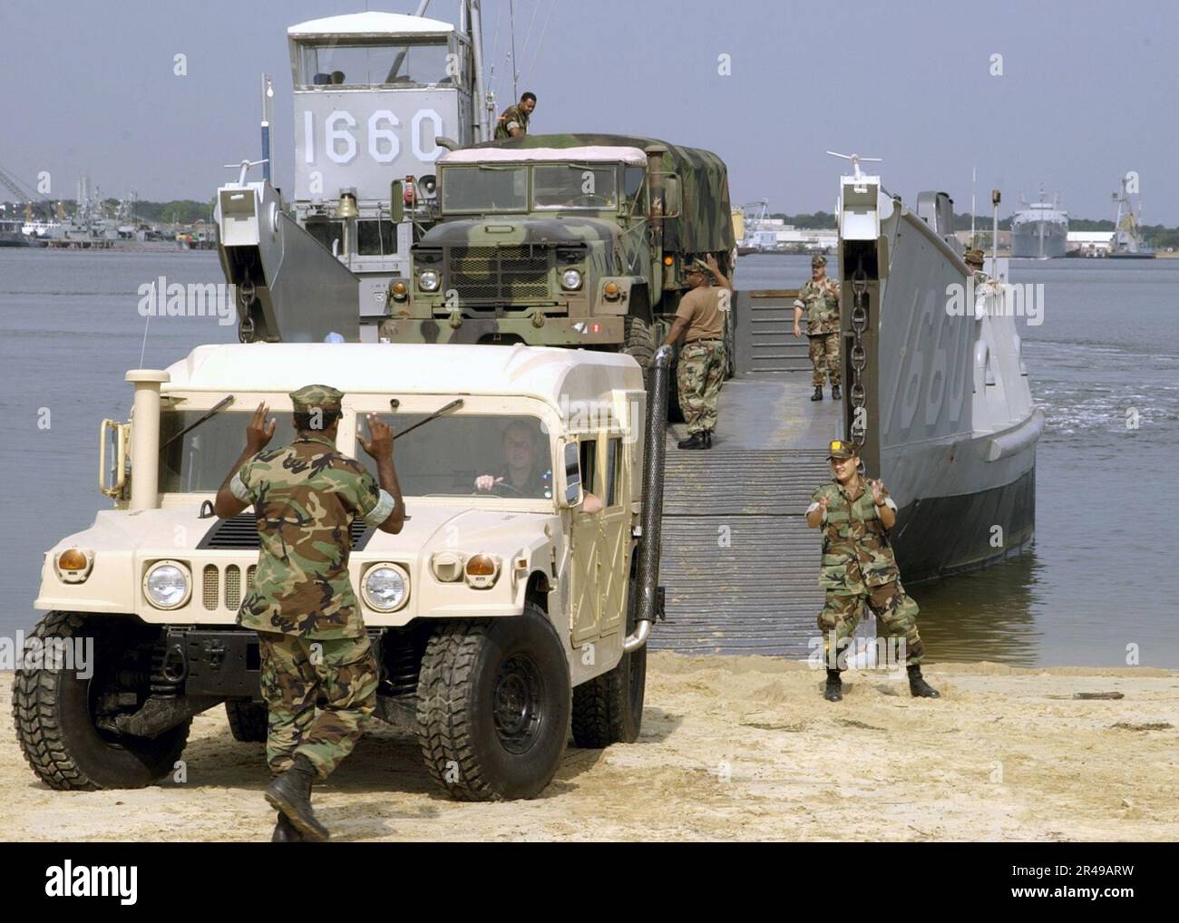 US Navy Personnel assigned to Naval Beach Group Two (NBG-2) load ...