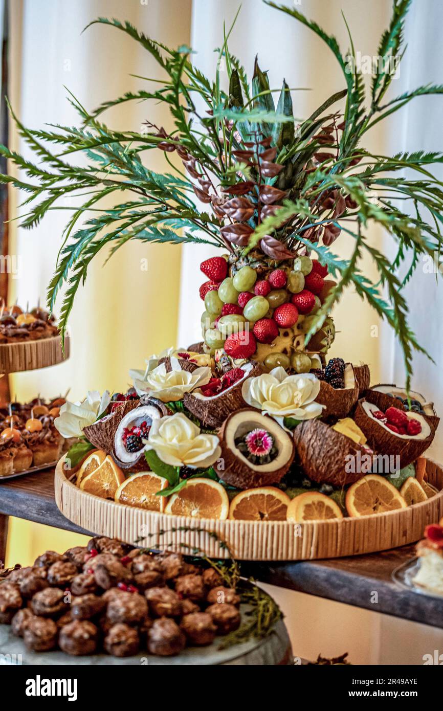 A fourchette table featuring fresh fruits decorated into a design Stock ...