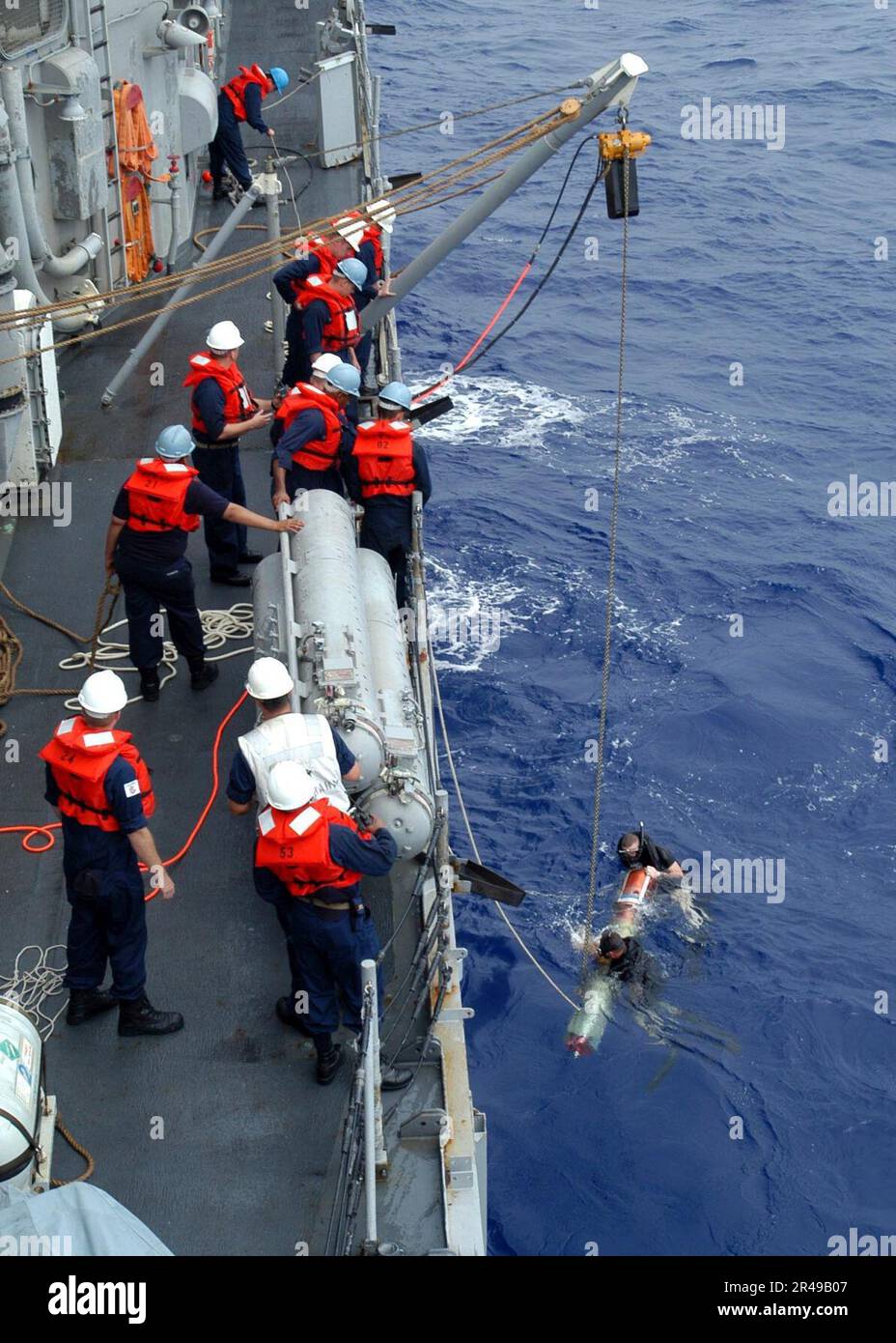 US Navy Search and Rescue (SAR) swimmers from the guided missile ...