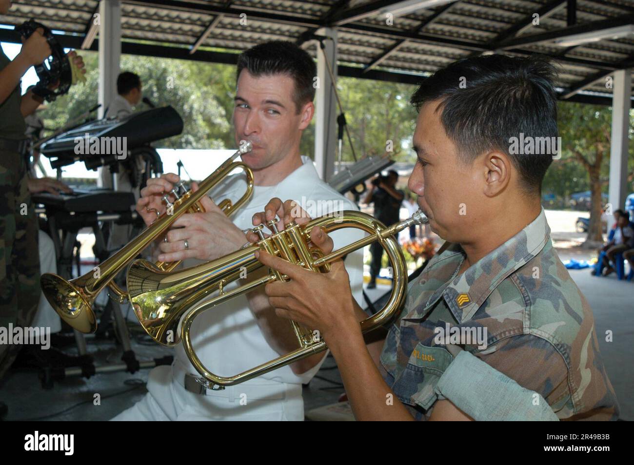 US Navy A Royal Thai Marine musician grabs his flugal horn and jumps in ...
