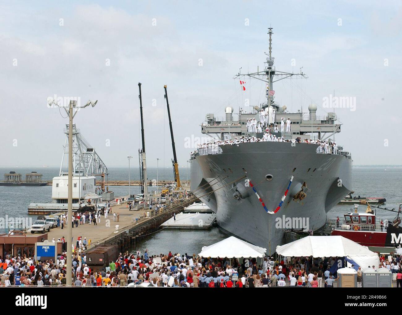 US Navy Family and friends gather on the pier to show their support as ...