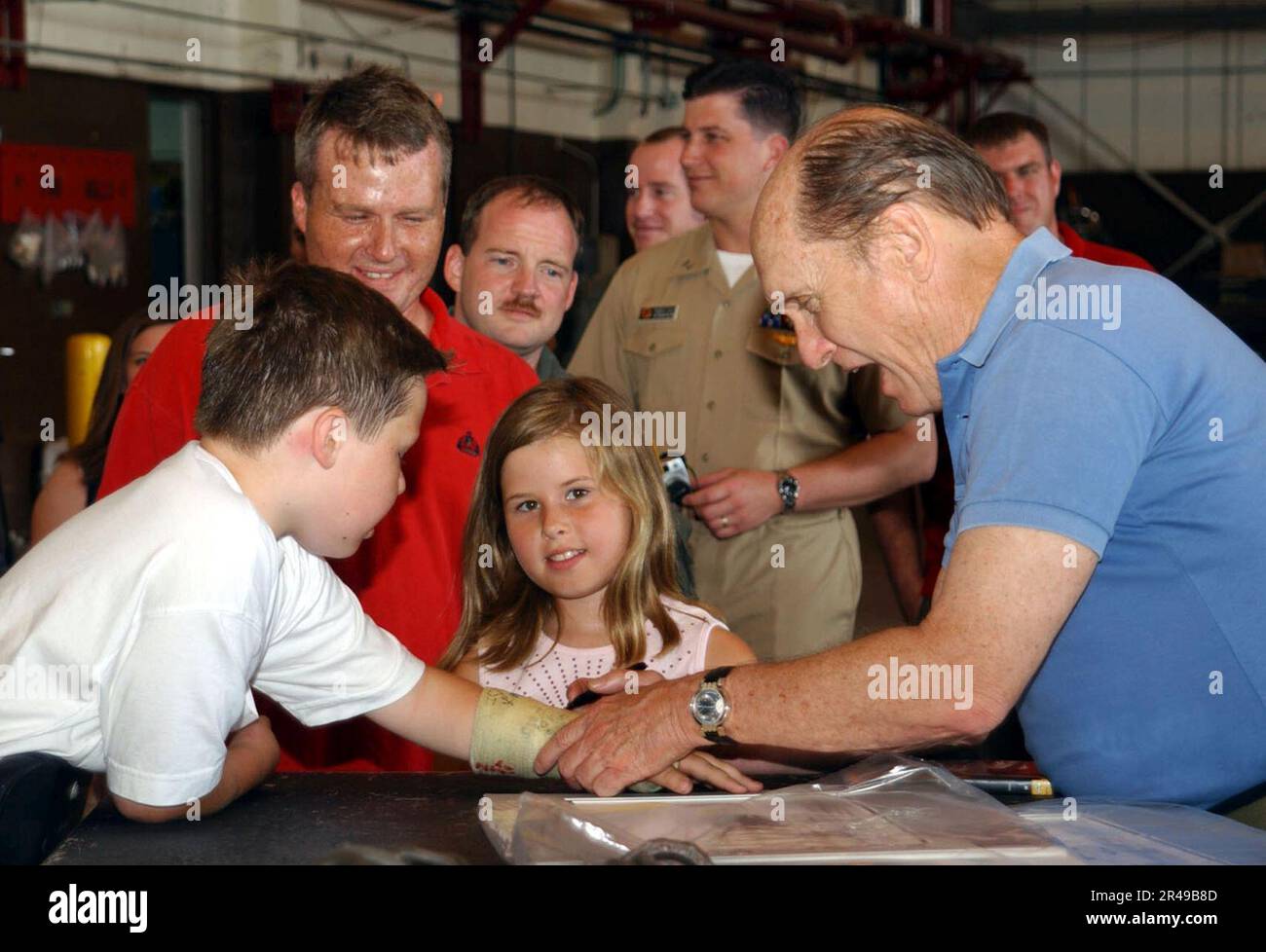 US Navy Robert Duvall autographs the cast for the son of a Sailor Stock ...