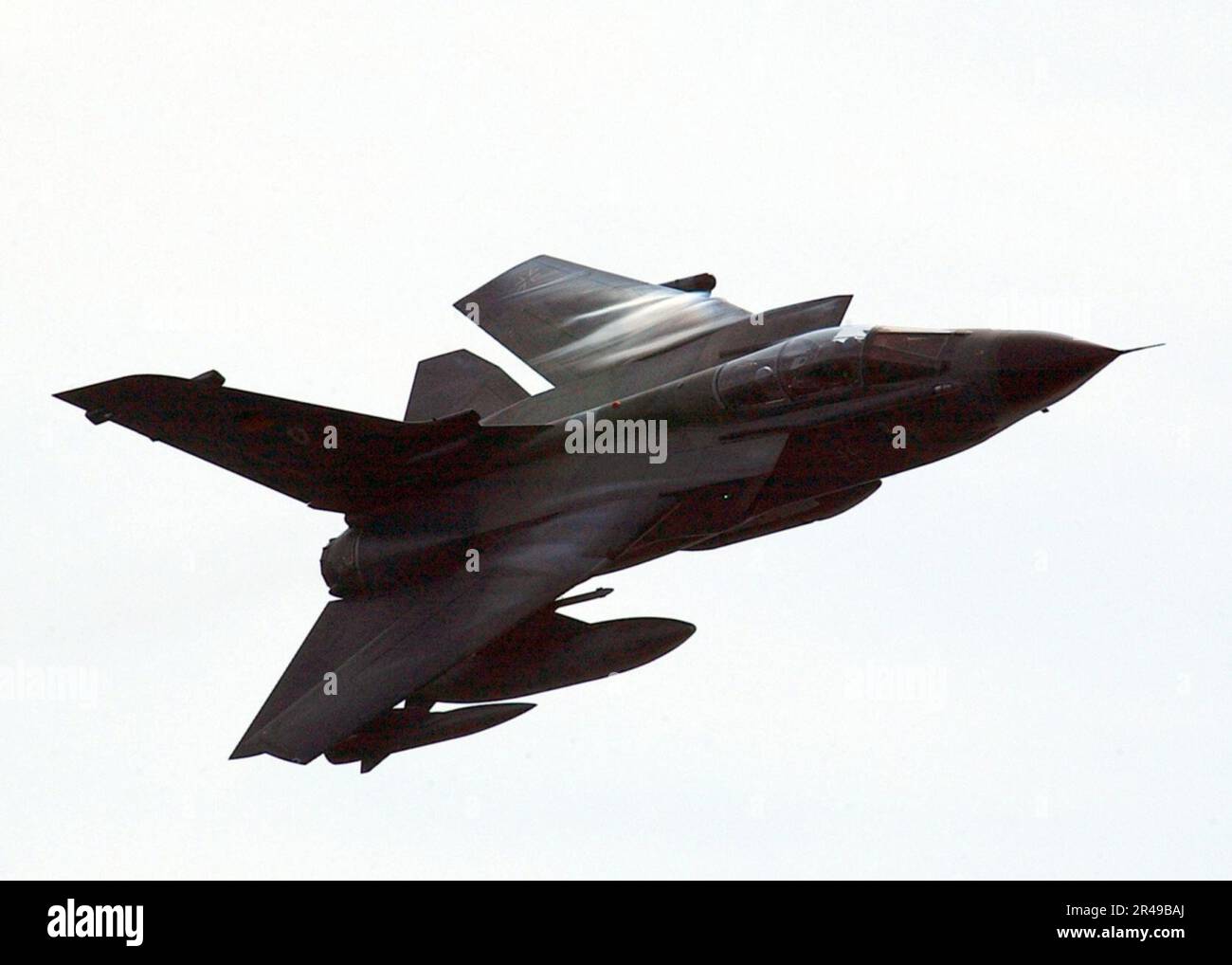 US Navy A German fighter jet Panavia Tornado GR.Mk 1, flies over the Aegis class, guided missile ...
