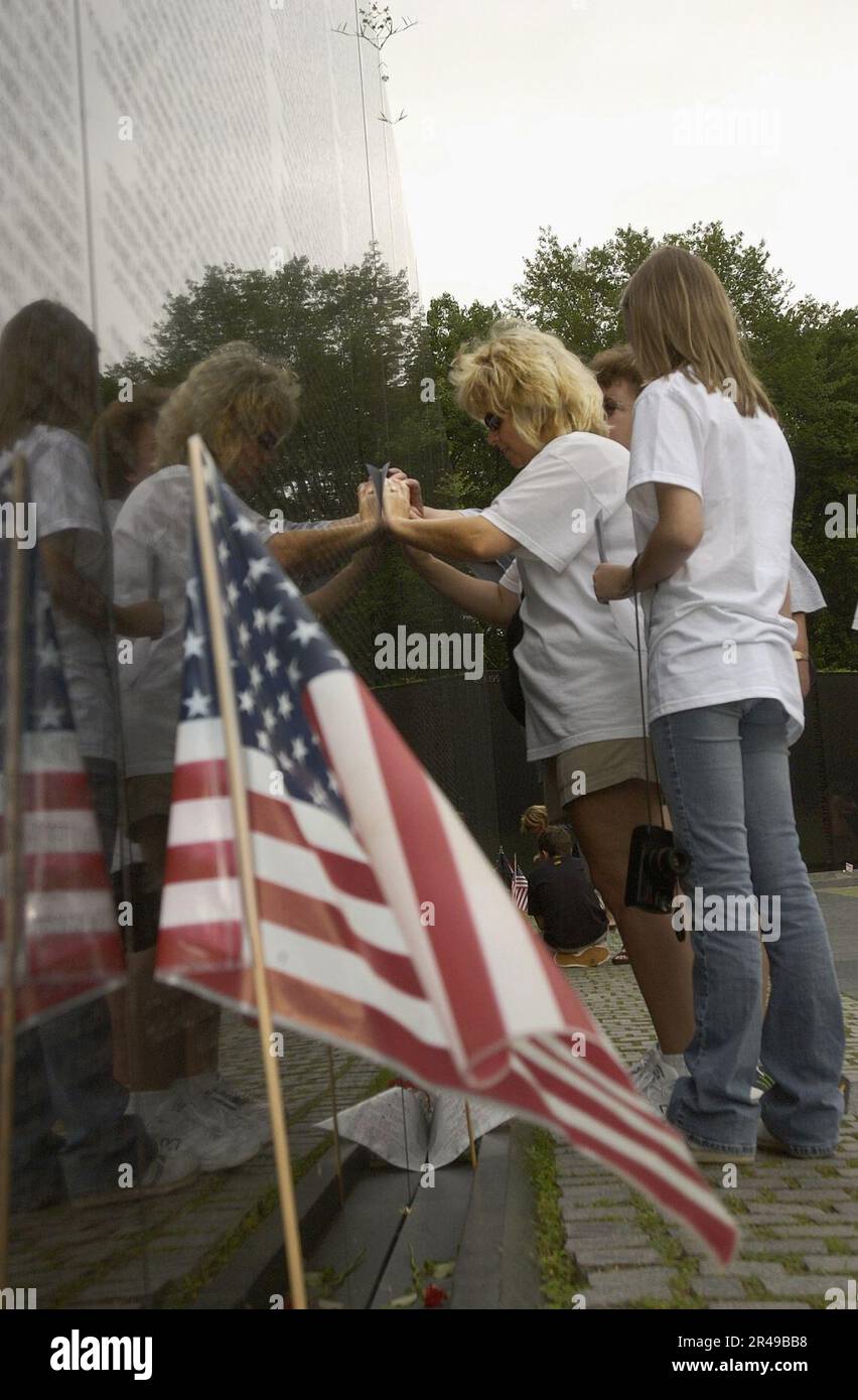 US Navy Visitors to the Vietnam Veterans Memorial Wall, take rubbings ...