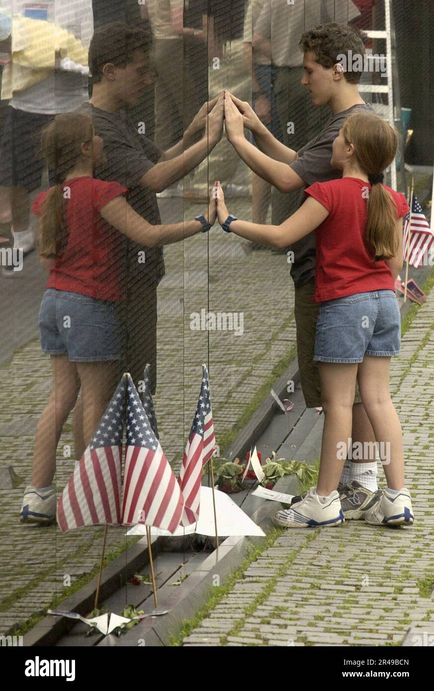 US Navy Visitors to the Vietnam Veterans Memorial Wall, read names of ...