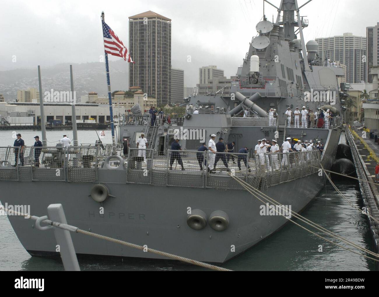 US Navy Crew members aboard the guided missile destroyer USS Hopper ...
