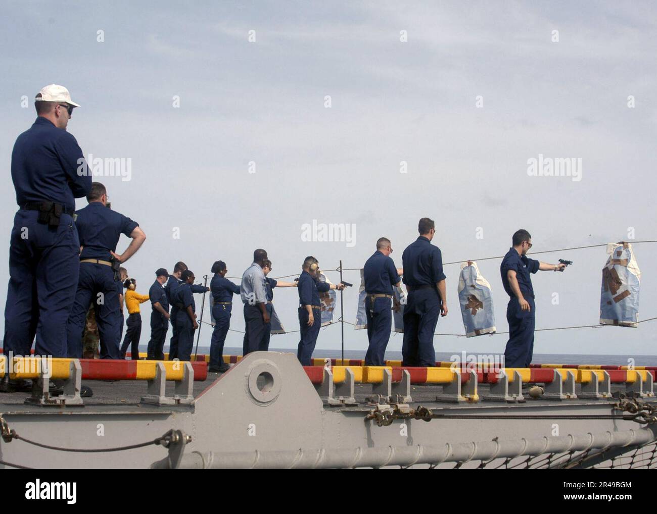 US Navy Crewmembers participate in a small arms shoot Stock Photo - Alamy