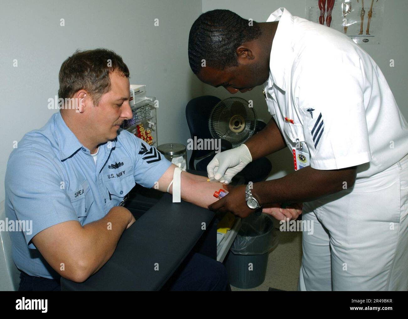 US Navy Hospital Corpsman Seaman draws blood from Ship Serviceman 1st ...