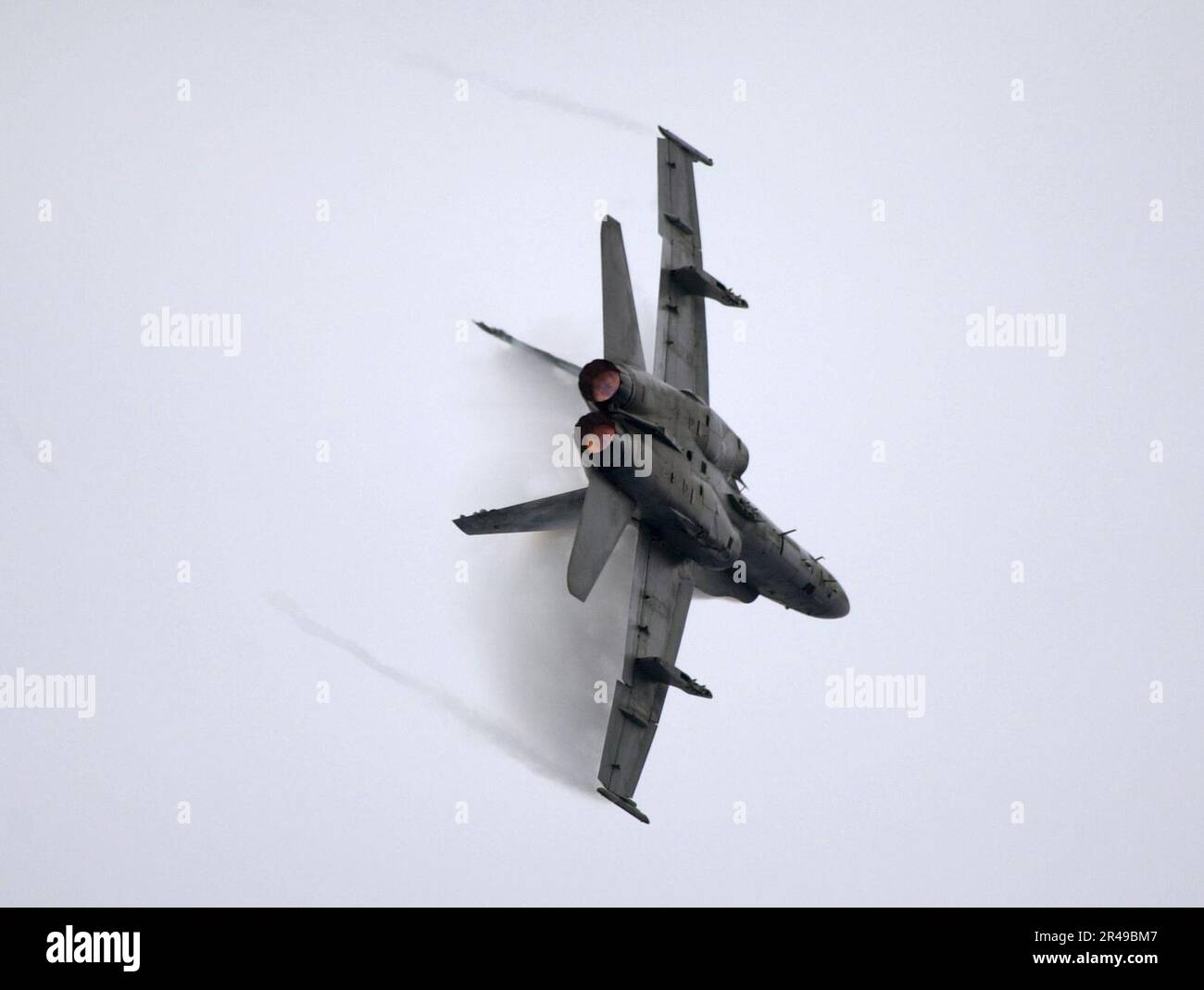 US Navy An F-A-18 Hornet performs a high-speed turn near the aircraft ...