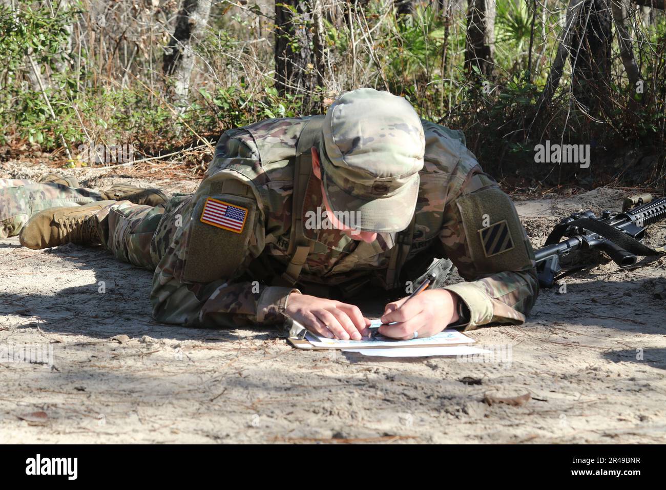 A 3rd Infantry Diision Soldier plots his coordinates during land ...