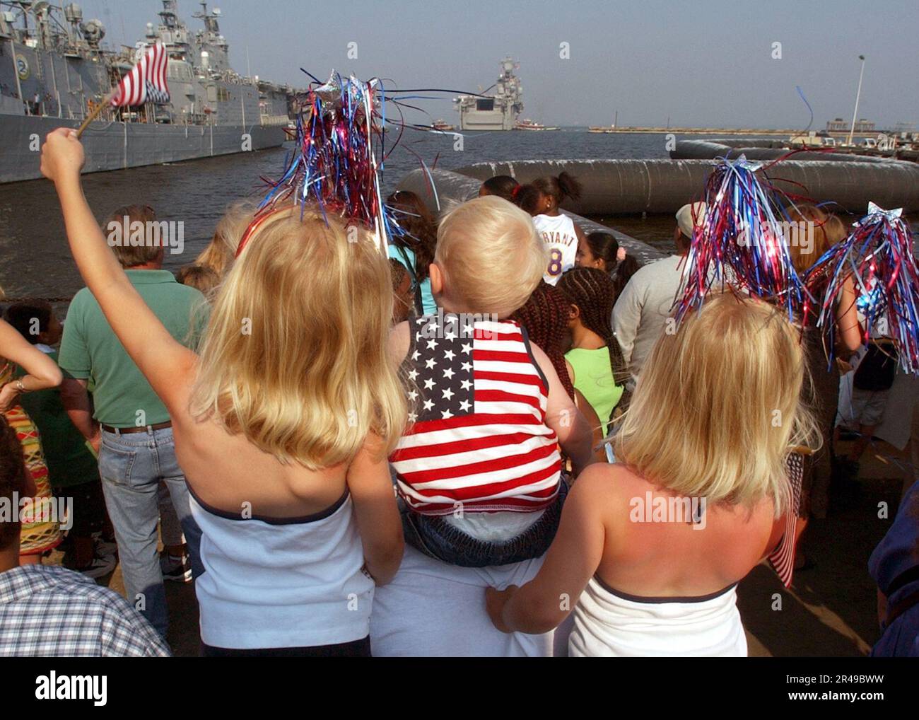 US Navy Friends and Family members gather on the pier to welcome home ...