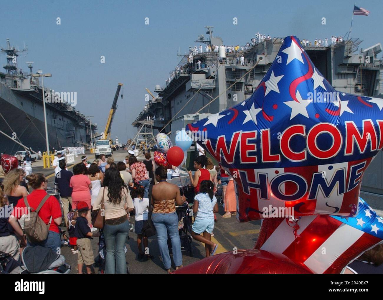 US Navy Friends and Family members gather on the pier to welcome home ...
