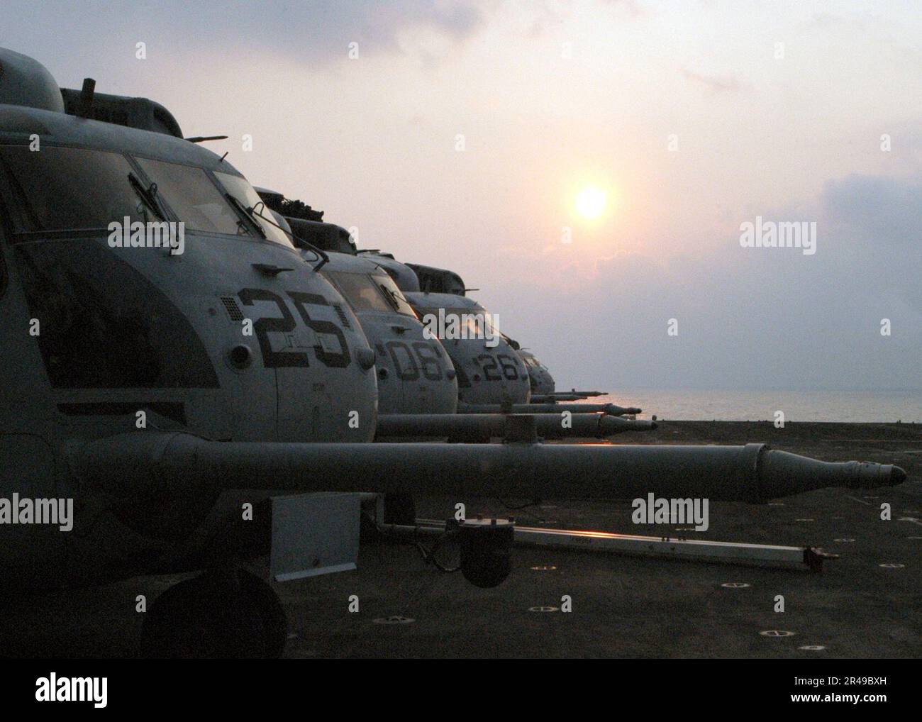 US Navy CH-53E Super Stallion helicopters sit on the flight deck aboard ...