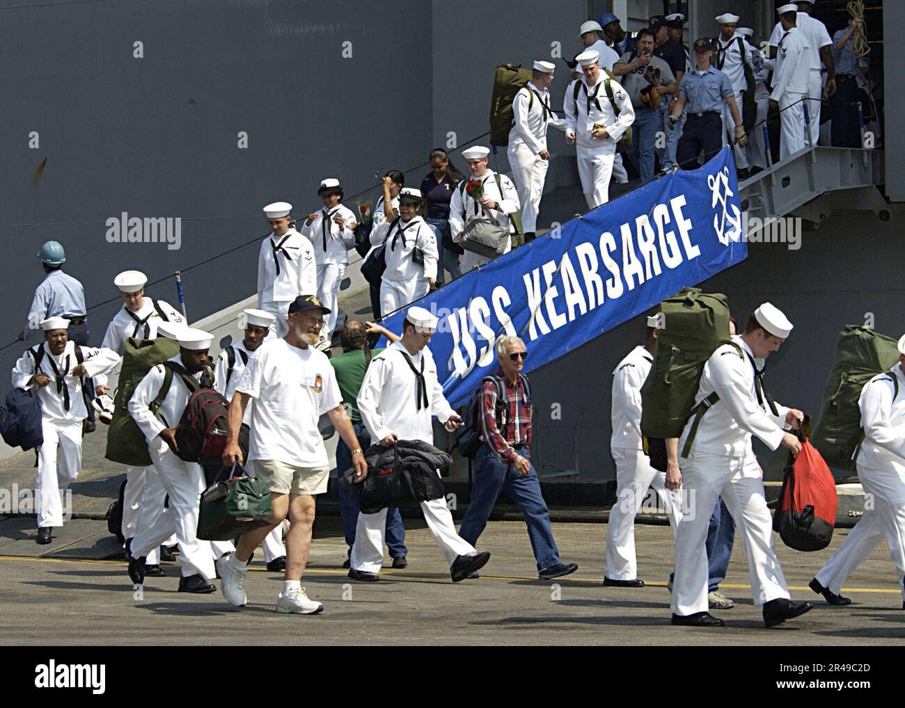 US Navy Sailors assigned to the USS Kearsarge (LHD-3) disembark the ...