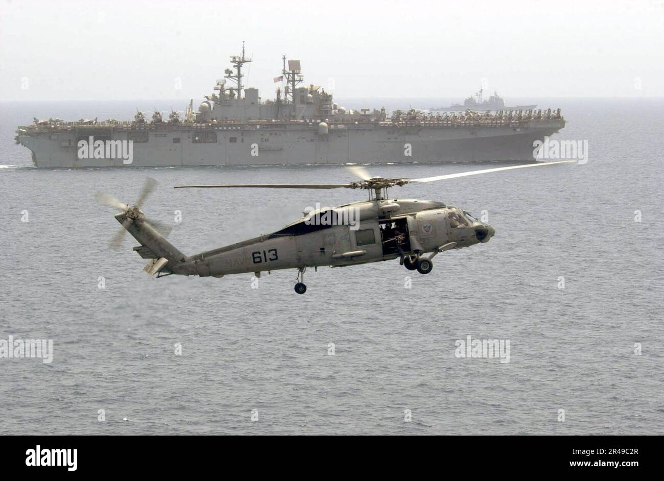 US Navy A SH-60 Seahawk helicopter comes in for a landing on the flight ...