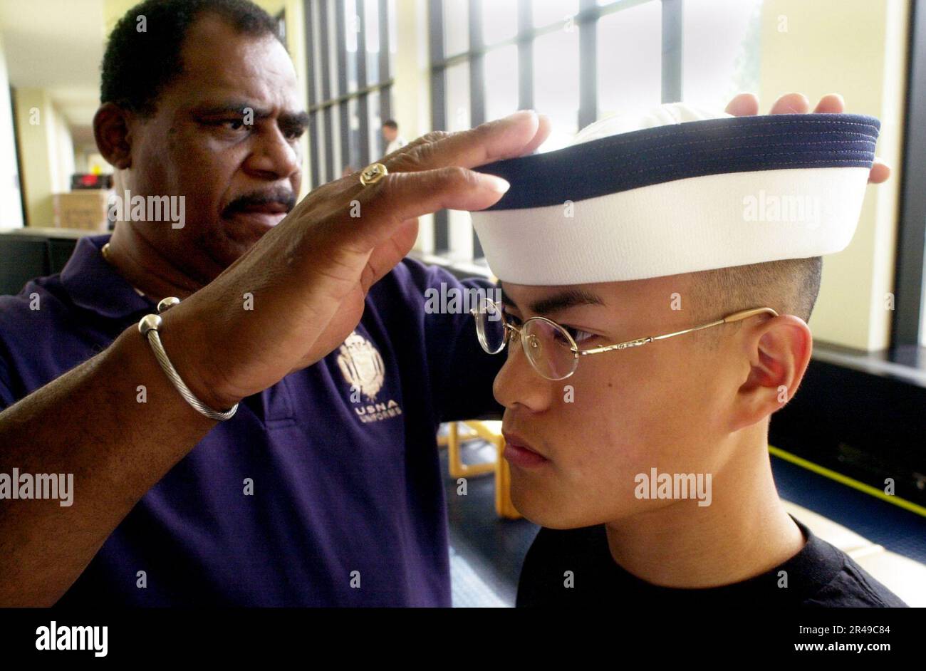 US Navy Officer candidate Byron Chen is fitted for a Plebe cover, at ...