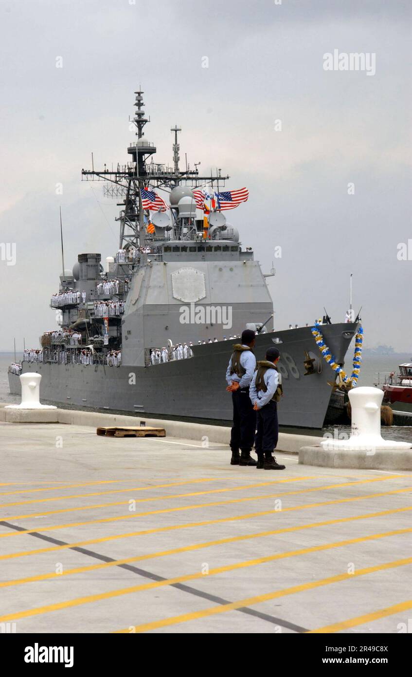 US Navy USS Anzio (CG 68) approaches the pier at its homeport at ...