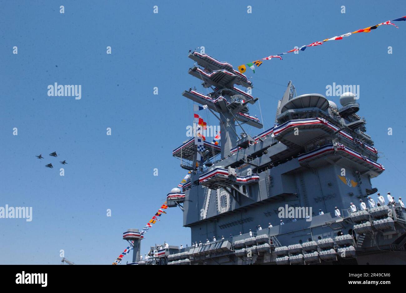 US Navy U.S. Navy fighter aircraft perform a flyover at the conclusion ...