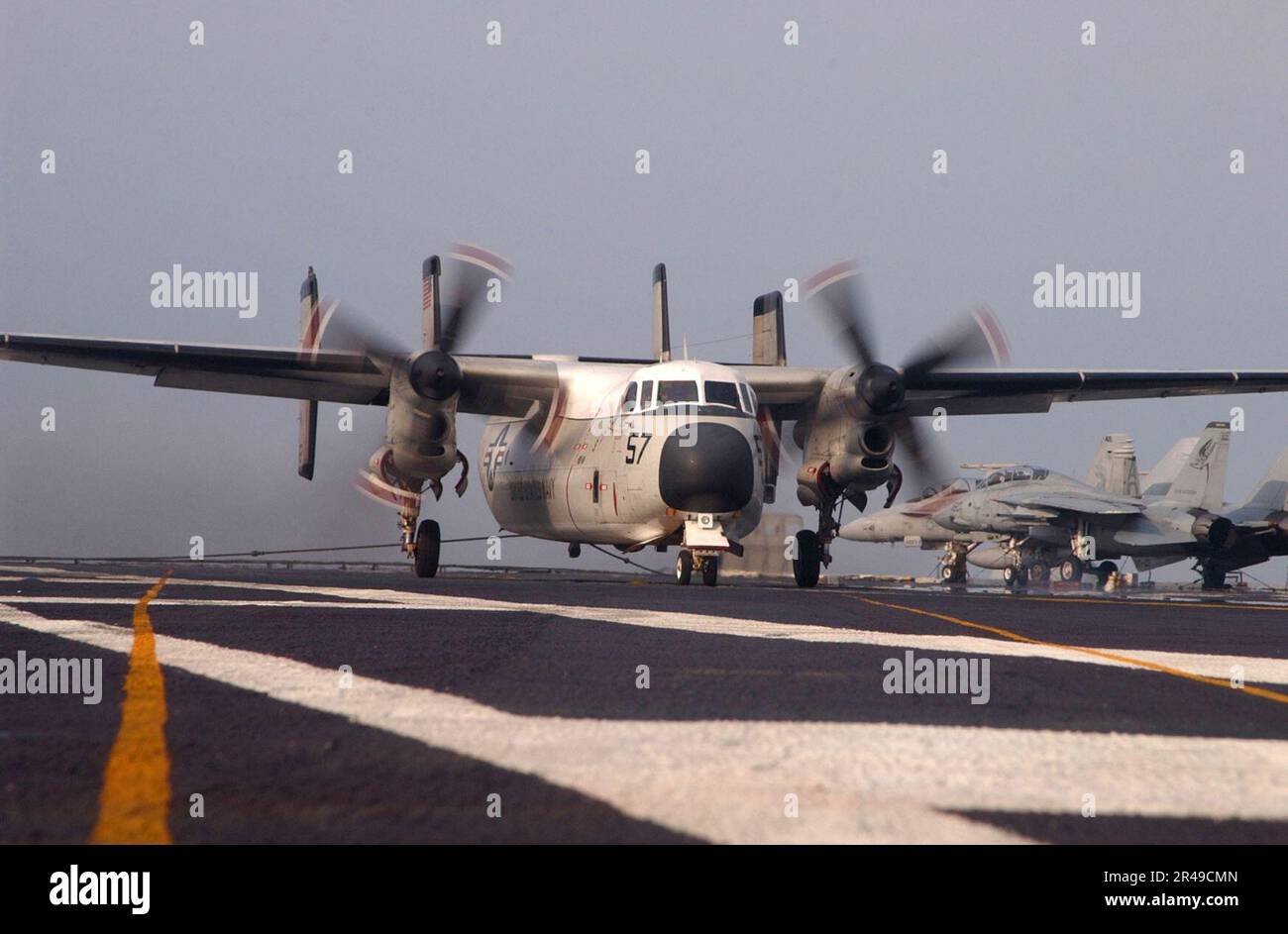 US Navy C-2 Greyhound makes an arrested landing on the flight deck ...