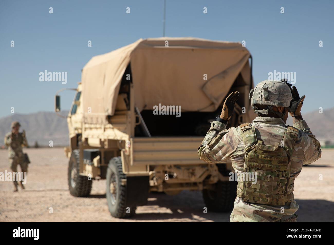1st Armored Division Soldiers lead a Light Medium Tactical Vehicle out ...