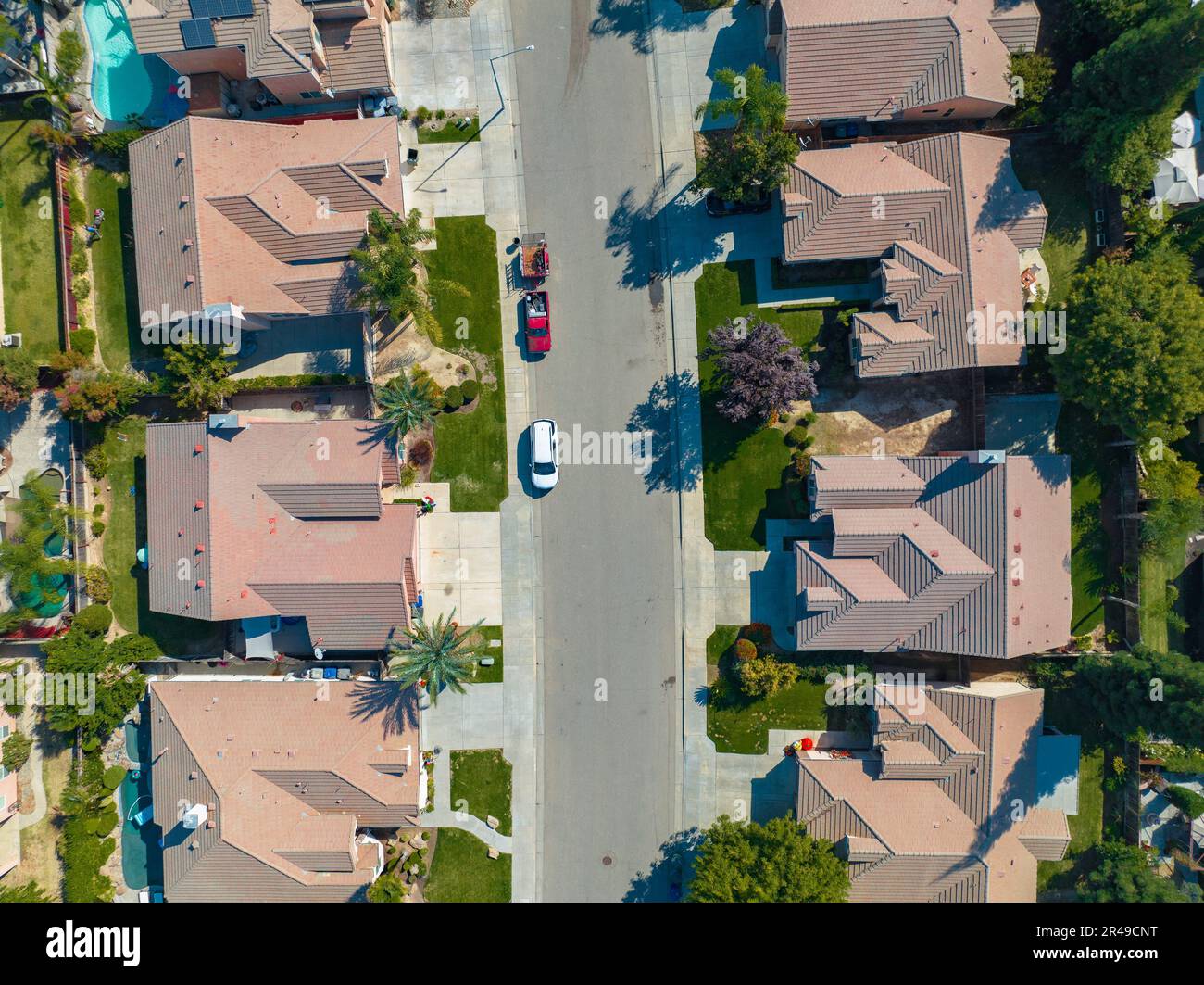 Aerial view of suburban residential area featuring a wide paved street ...