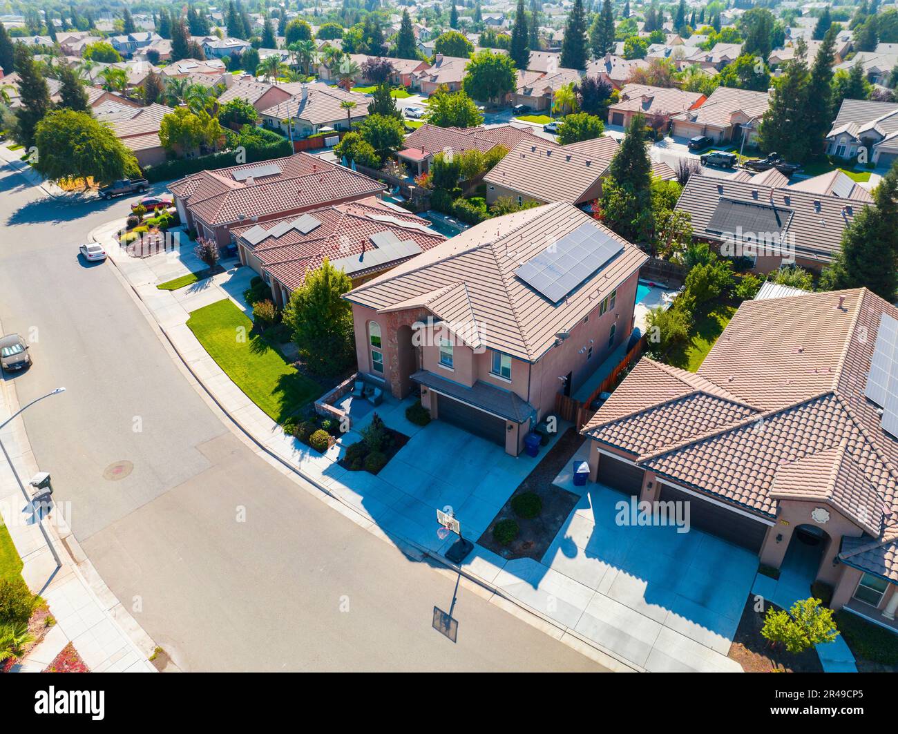 Aerial view of suburban residential area featuring a wide paved street ...