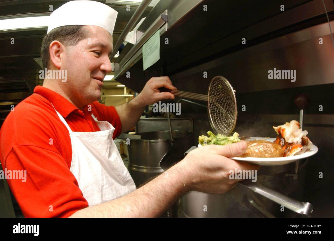 US Navy Mess Management Specialist 1st Class prepares the July Birthday ...