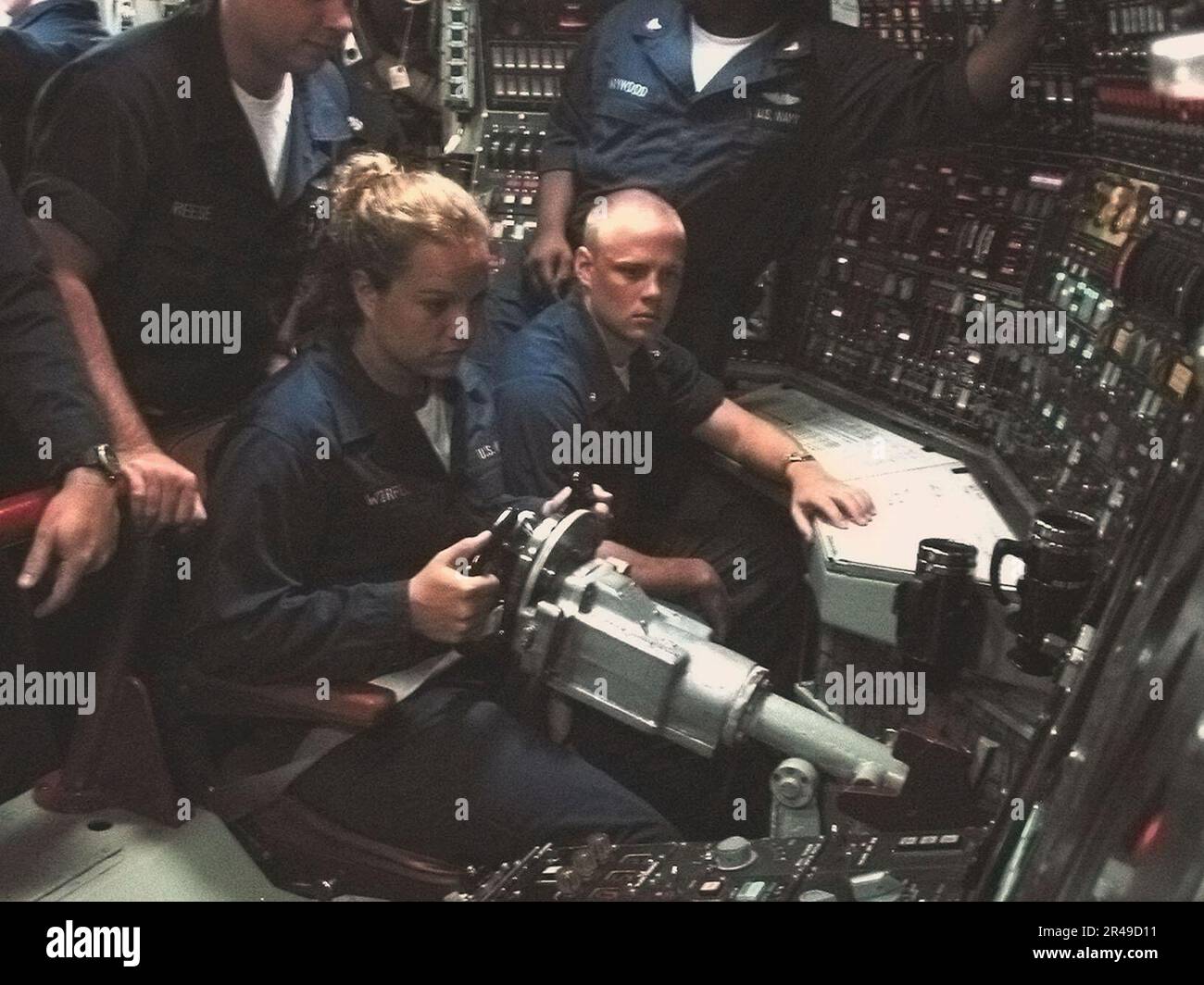 US Navy Midshipman Kelly Wirfel pulls the yoke to direct the submarine ...